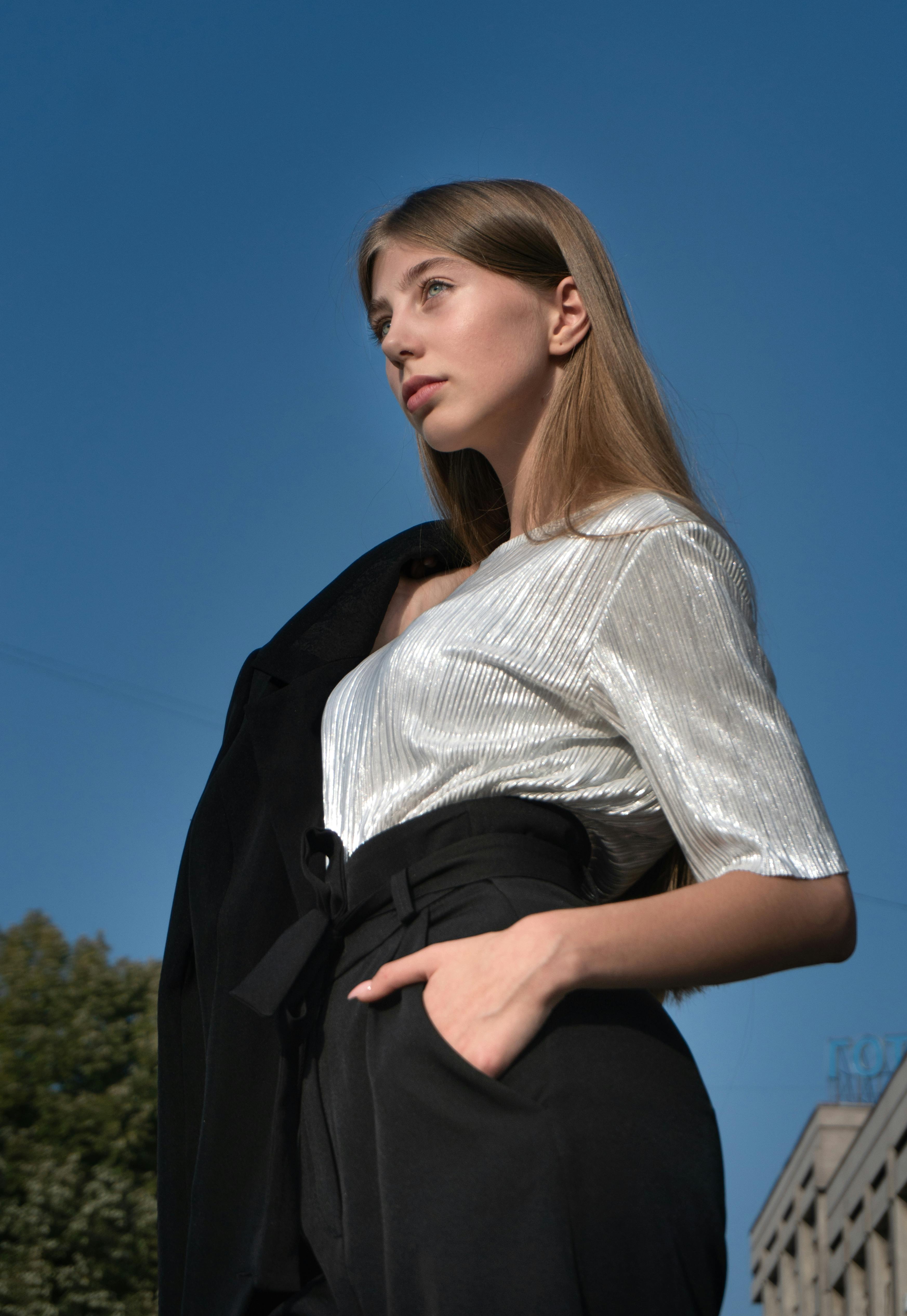 A Woman Shading Herself From the Sun · Free Stock Photo