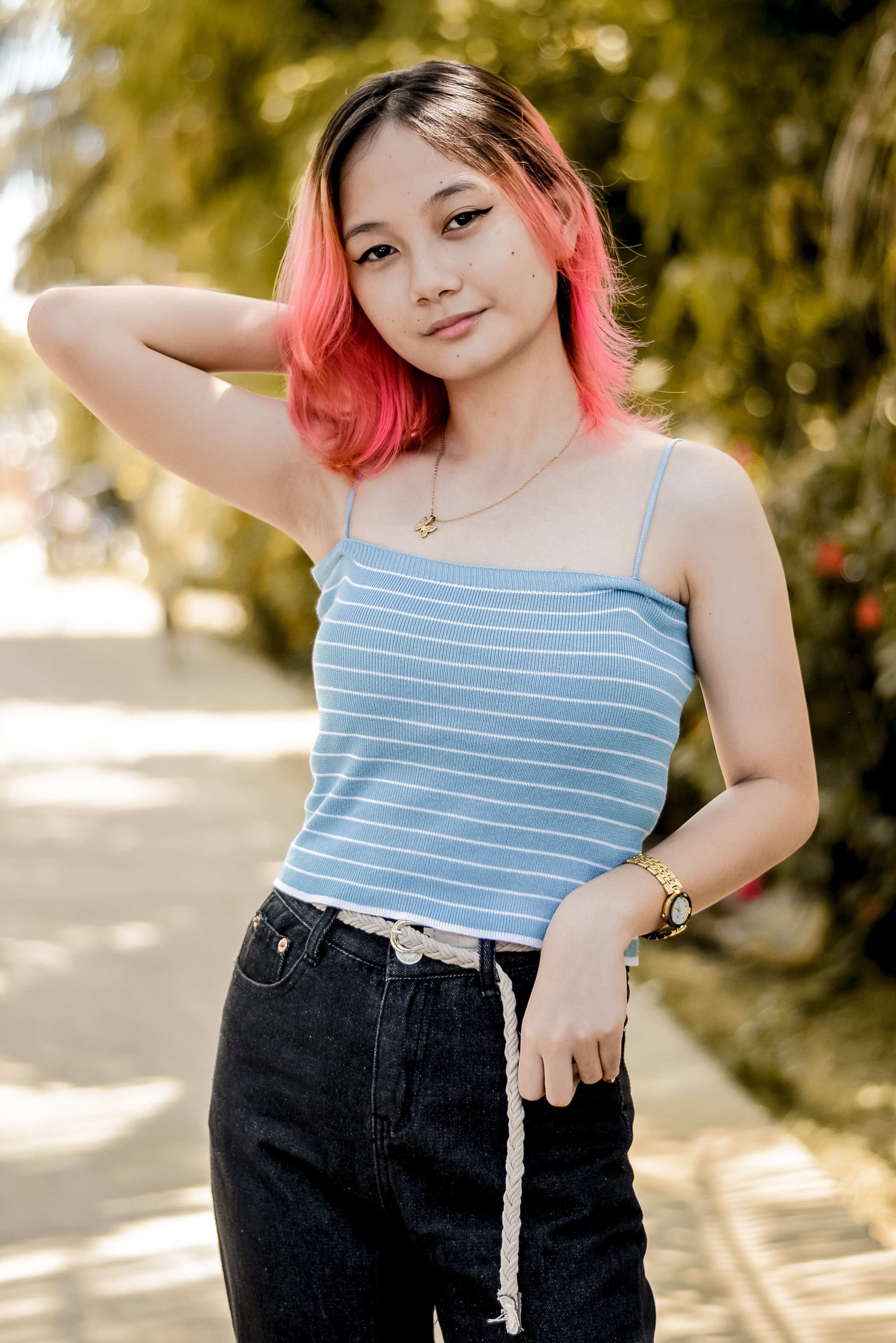 Woman with Dyed Hair Sitting by Table · Free Stock Photo