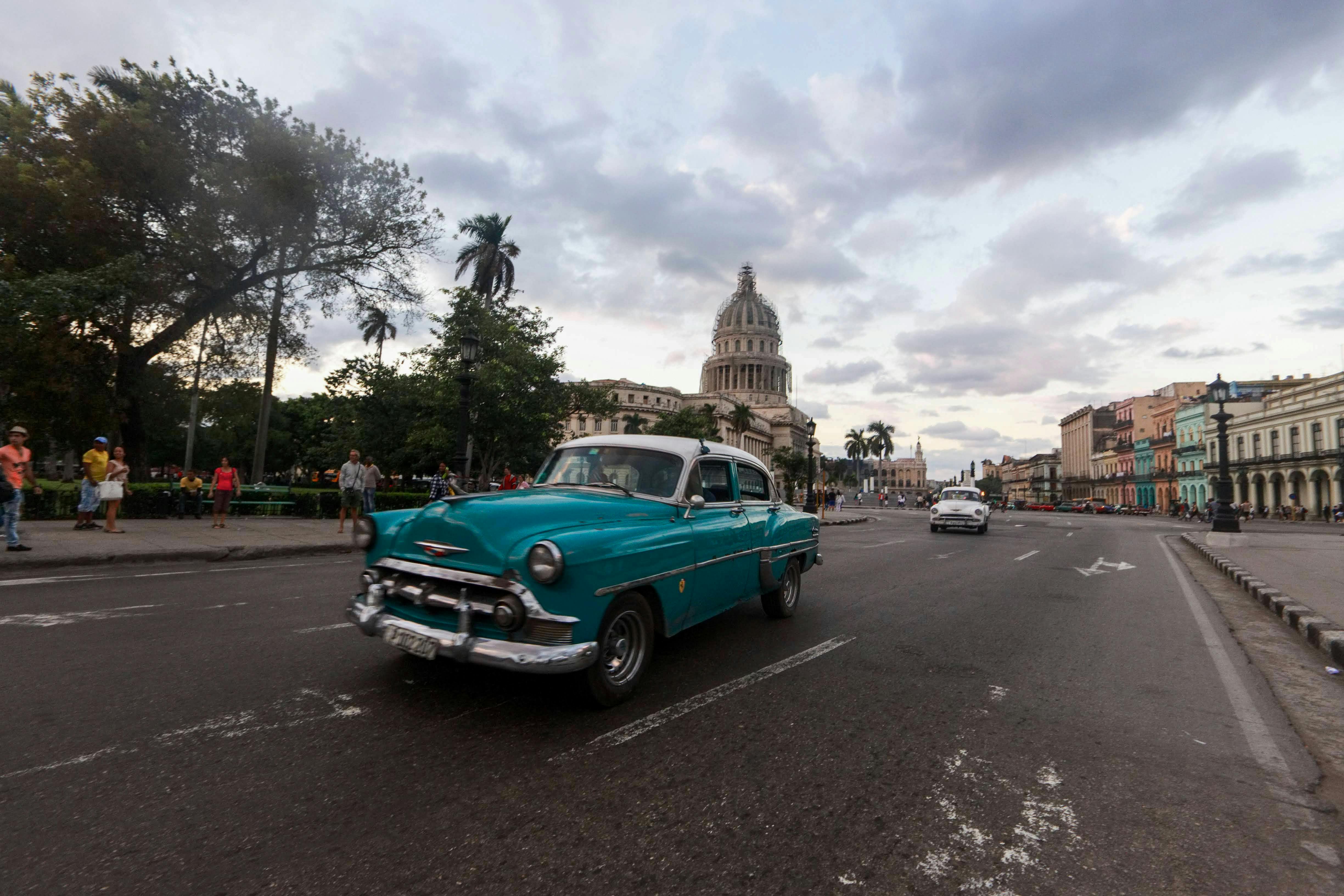 A Vintage Car in a City · Free Stock Photo