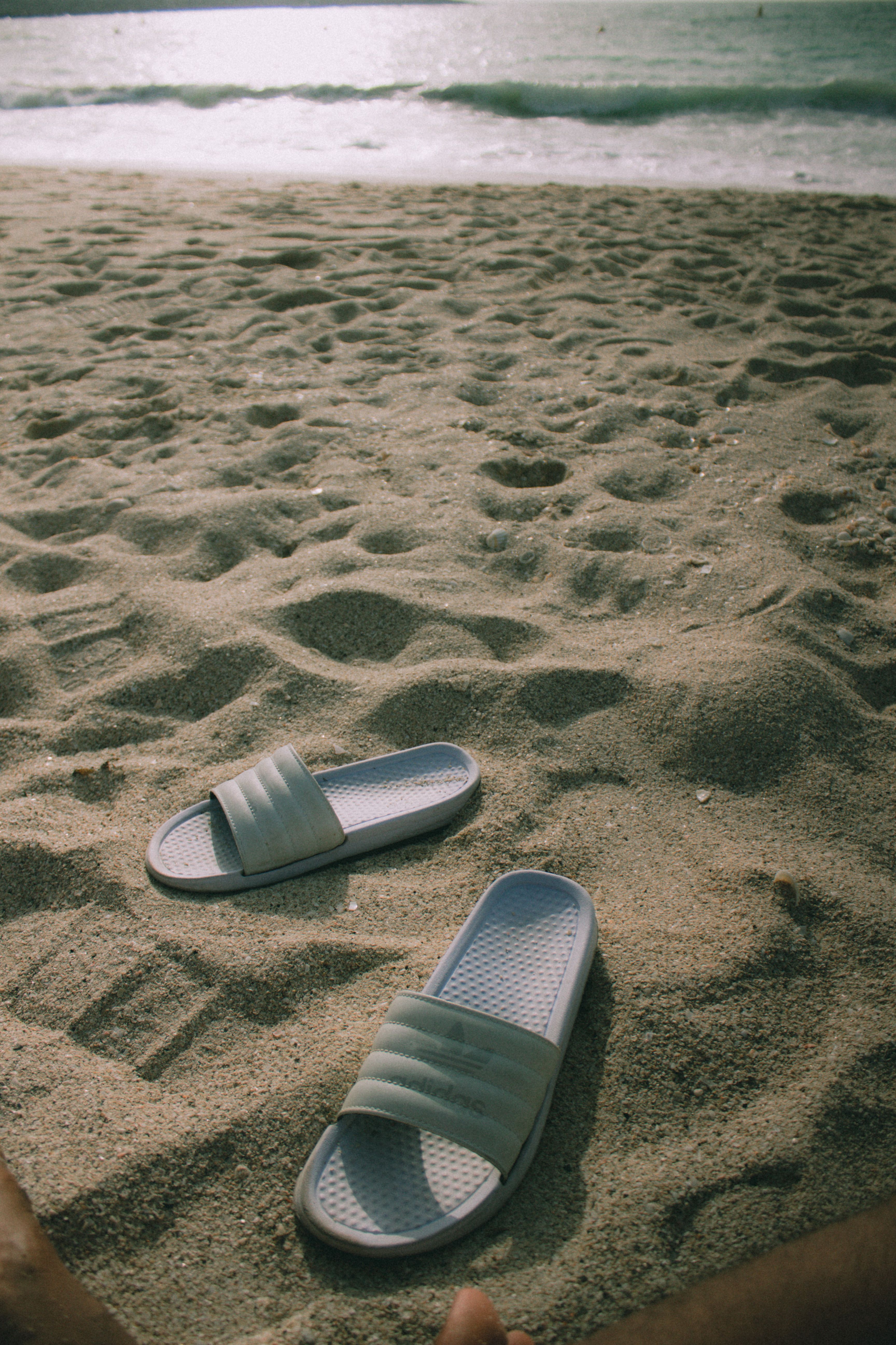White Slippers on Sand · Free Stock Photo