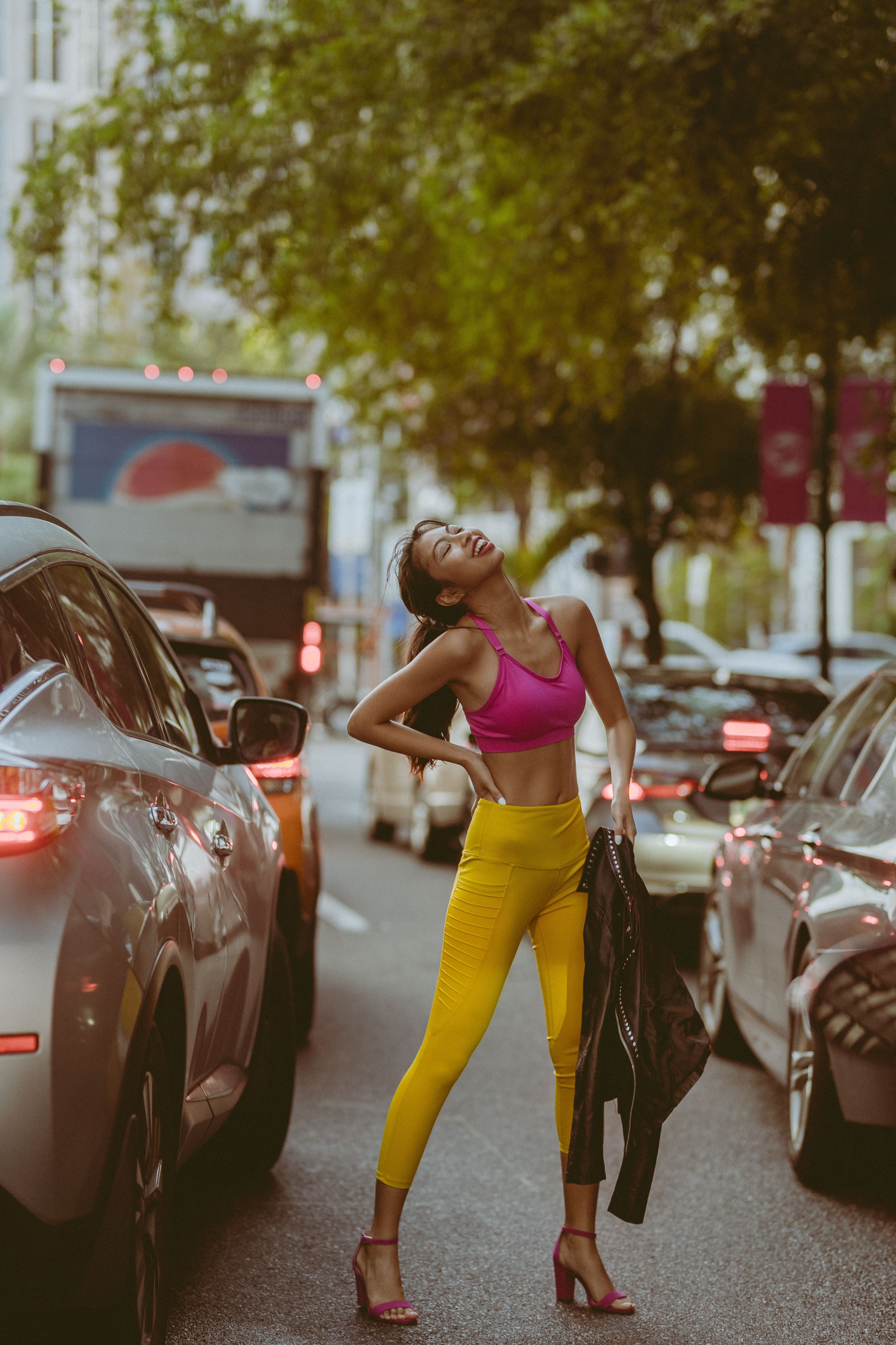 Woman Posing among Cars on Street · Free Stock Photo