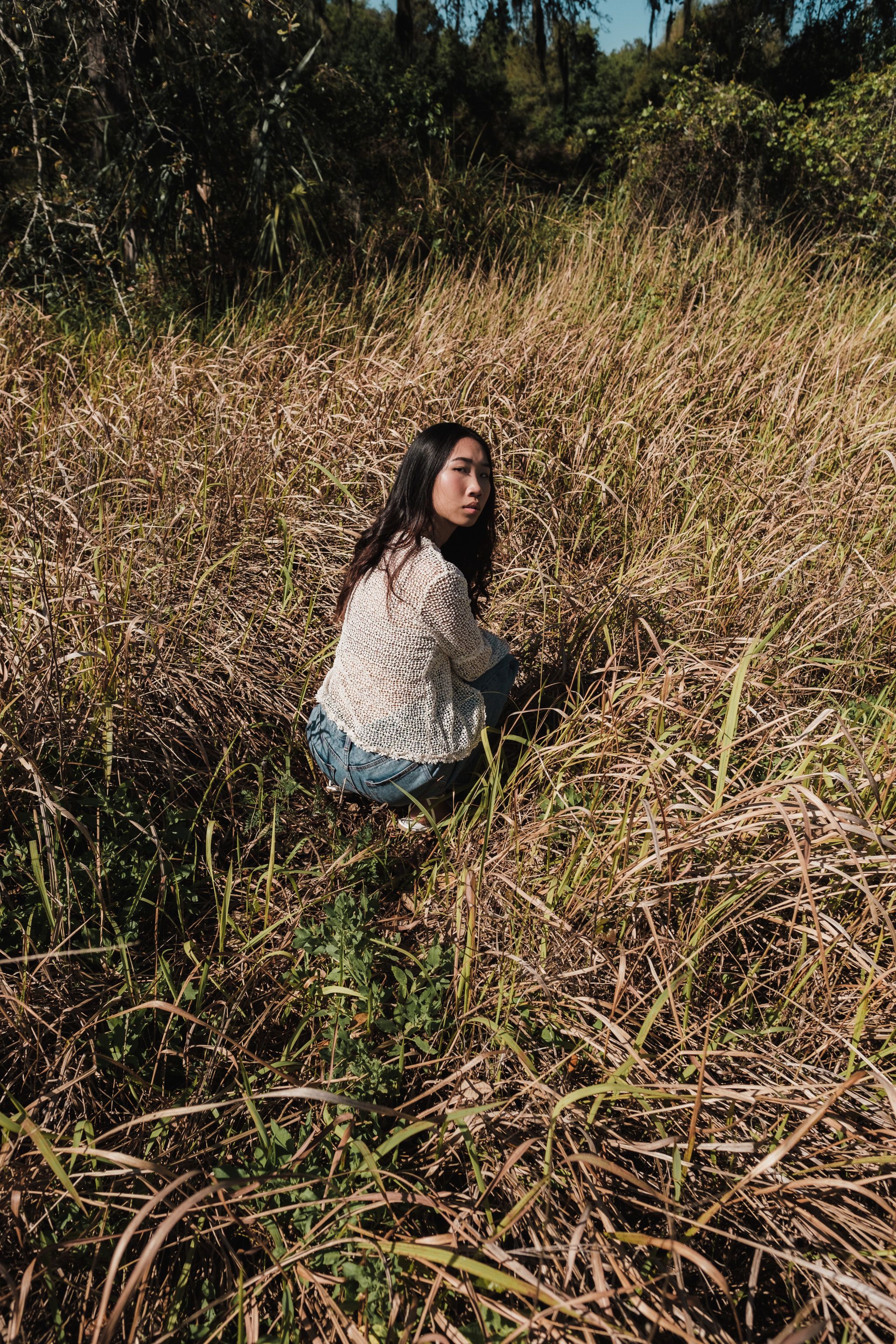Woman in Lace Cardigan sitting on Grass · Free Stock Photo