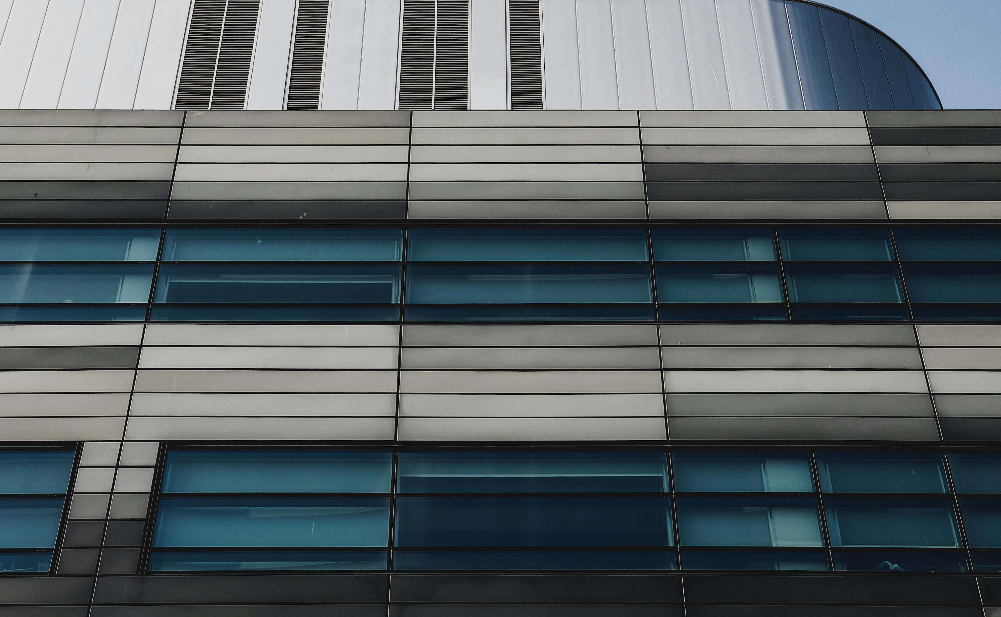 Low Angle Shot of a Glass Building · Free Stock Photo