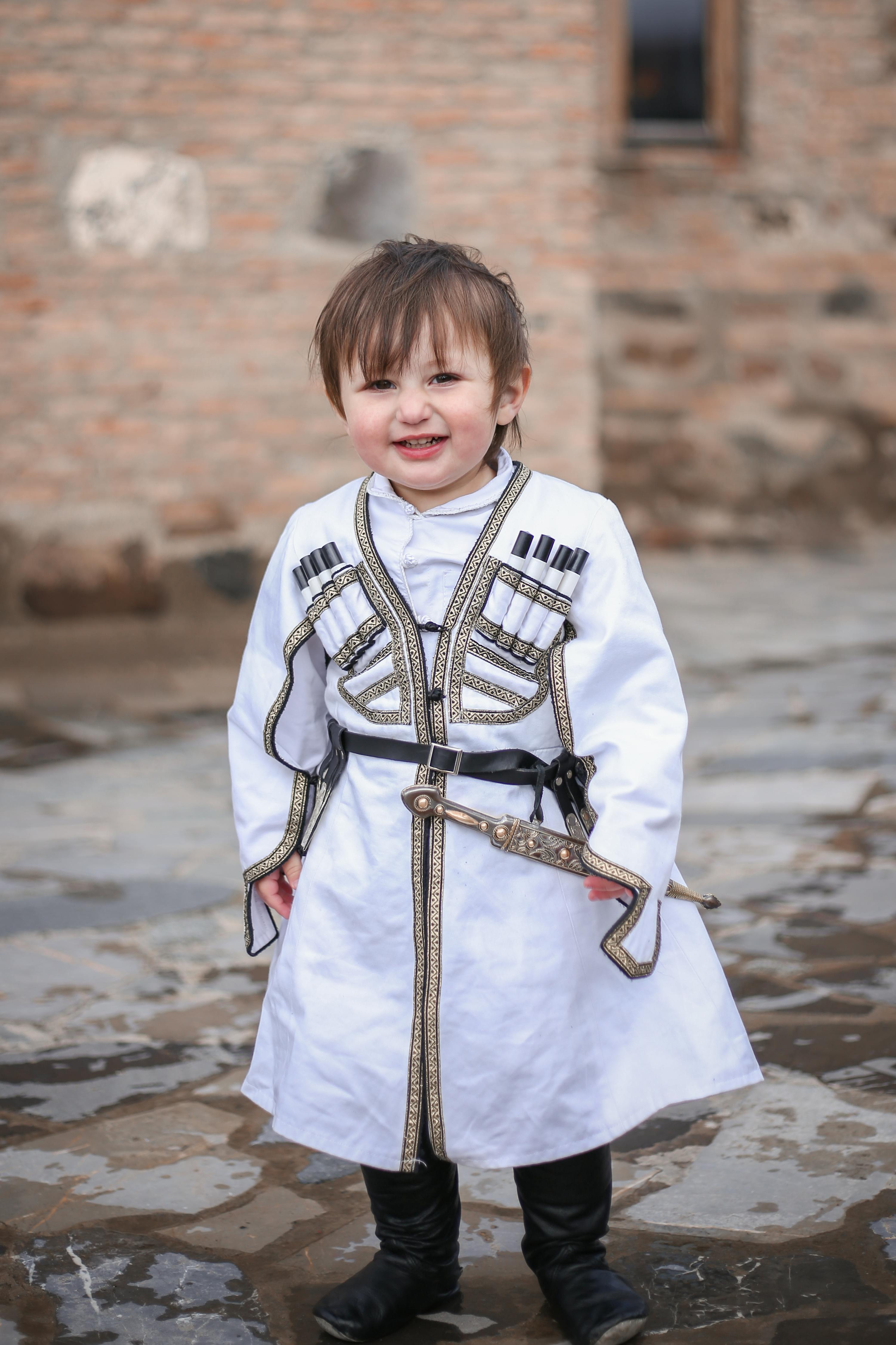 A Boy in White and Black Robe · Free Stock Photo