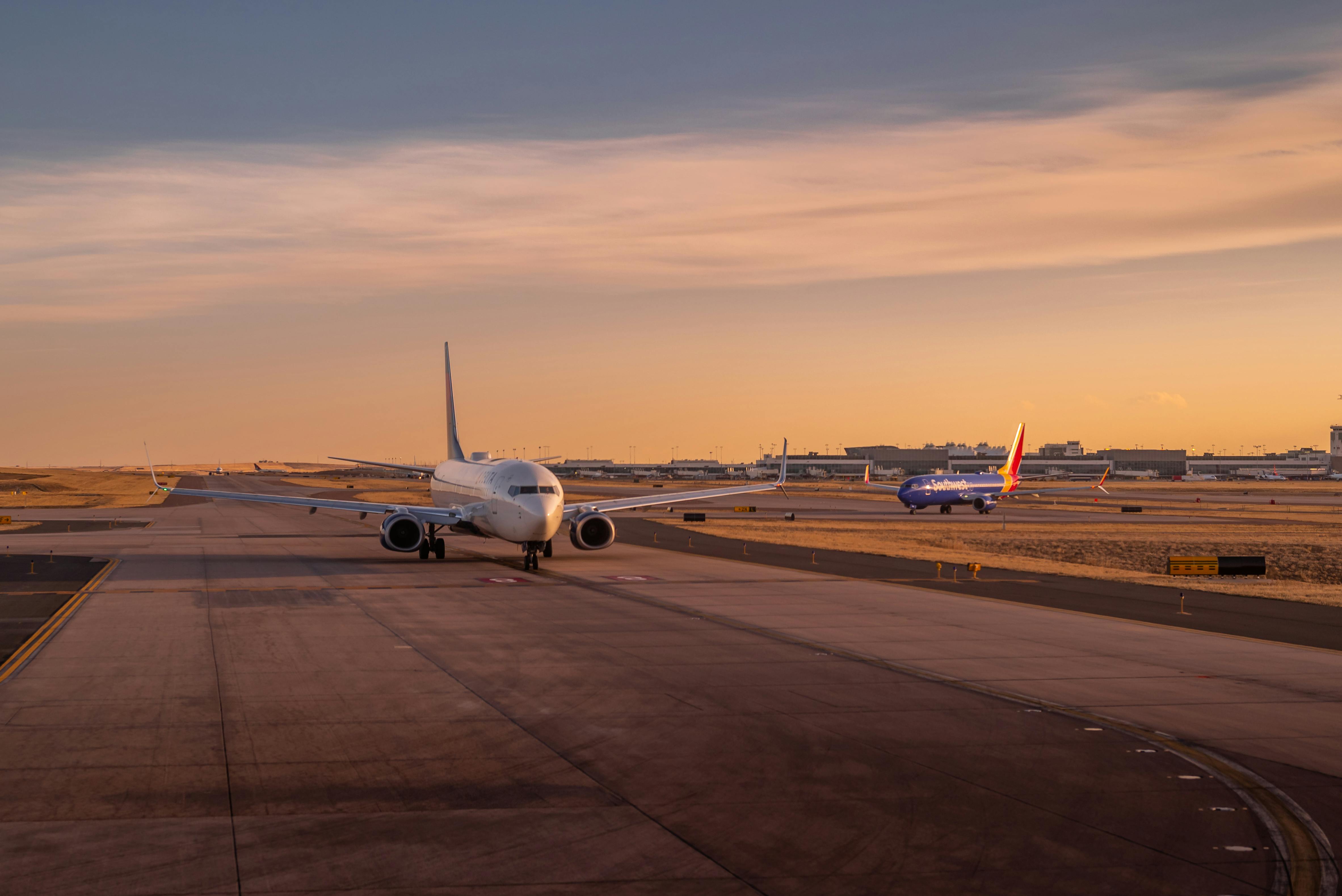 Airplanes on the Runway at Sunset · Free Stock Photo