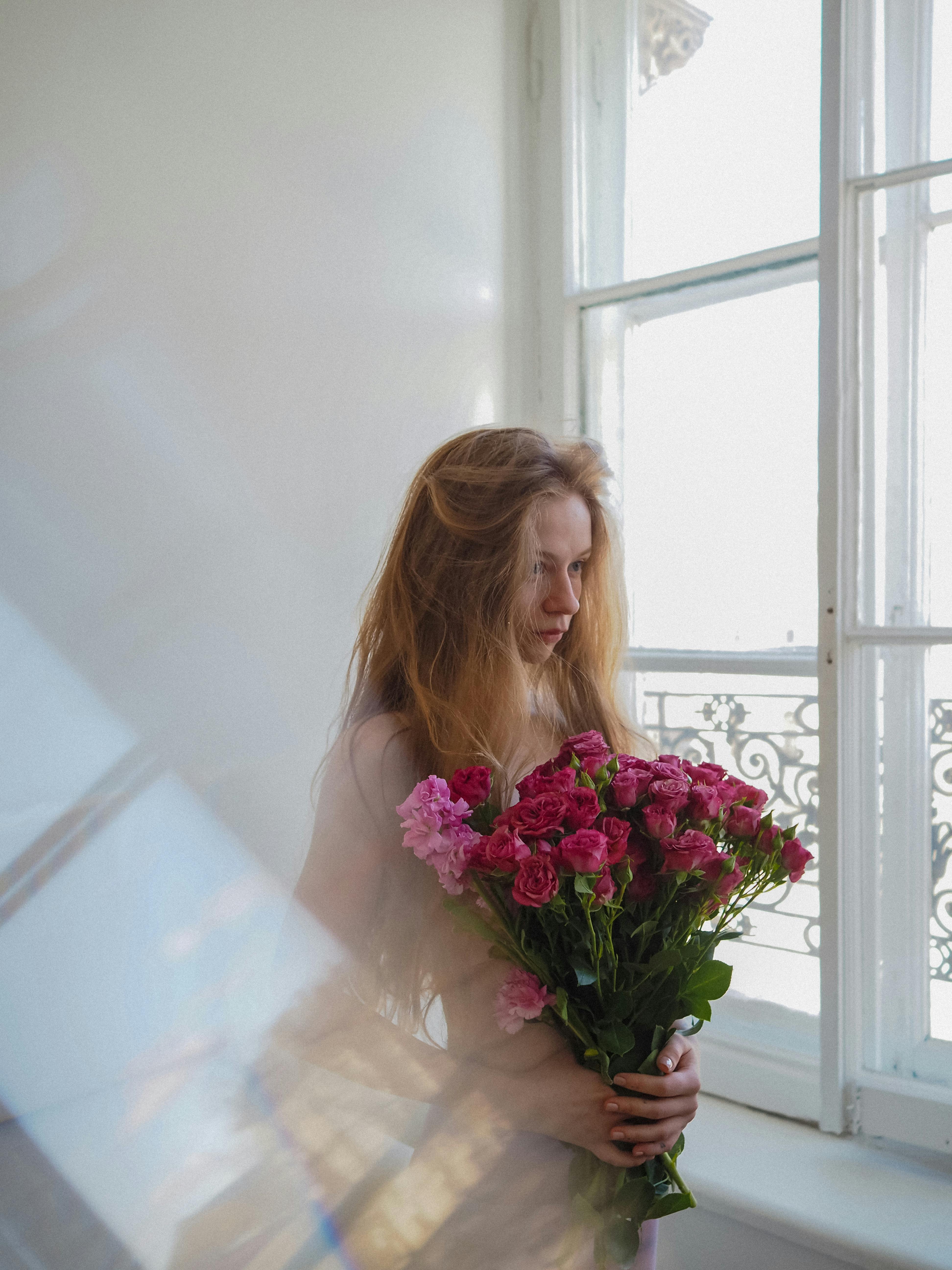 Woman Holding Pink Roses Bouquet · Free Stock Photo