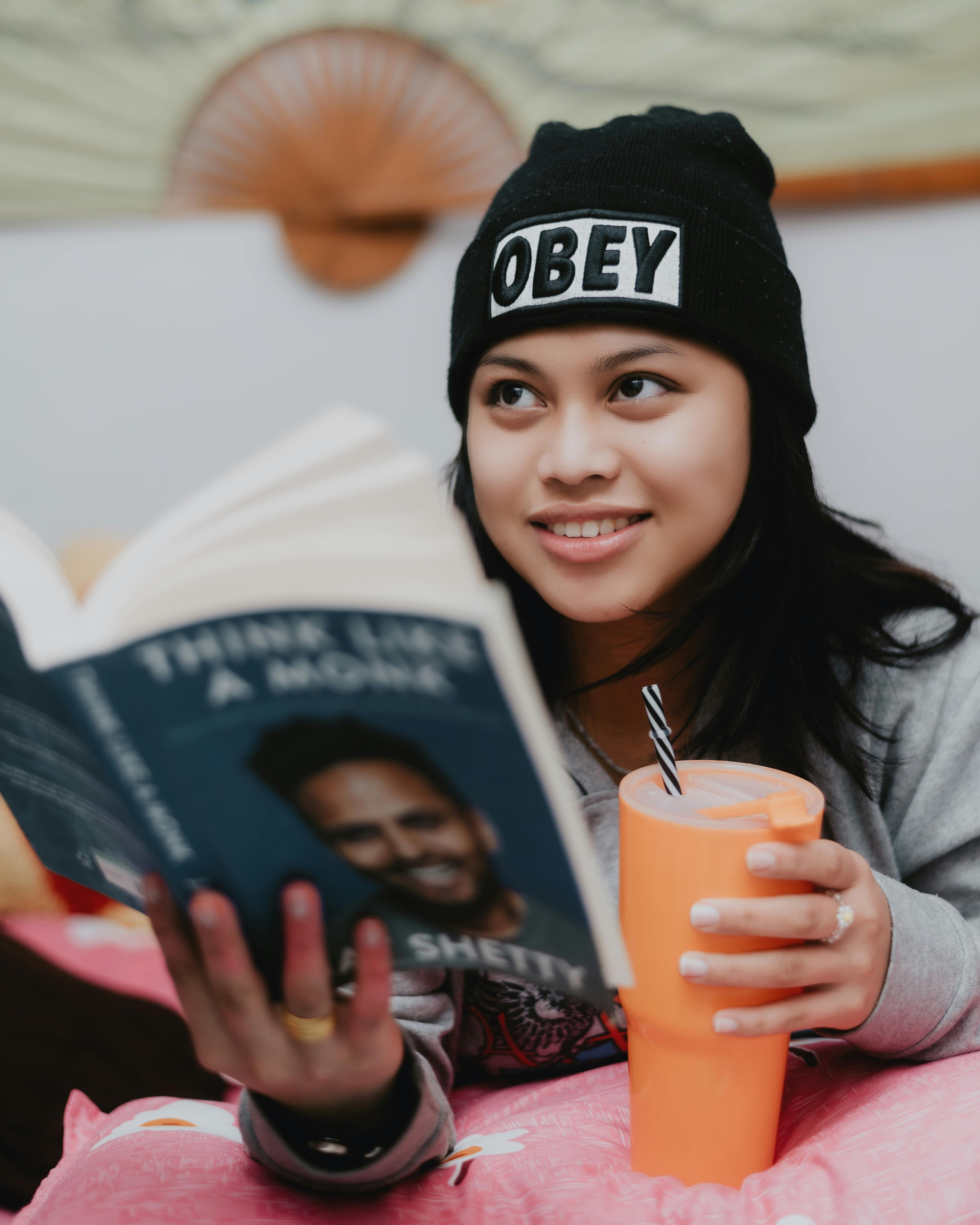 Woman Wearing a Beanie Reading a Book · Free Stock Photo