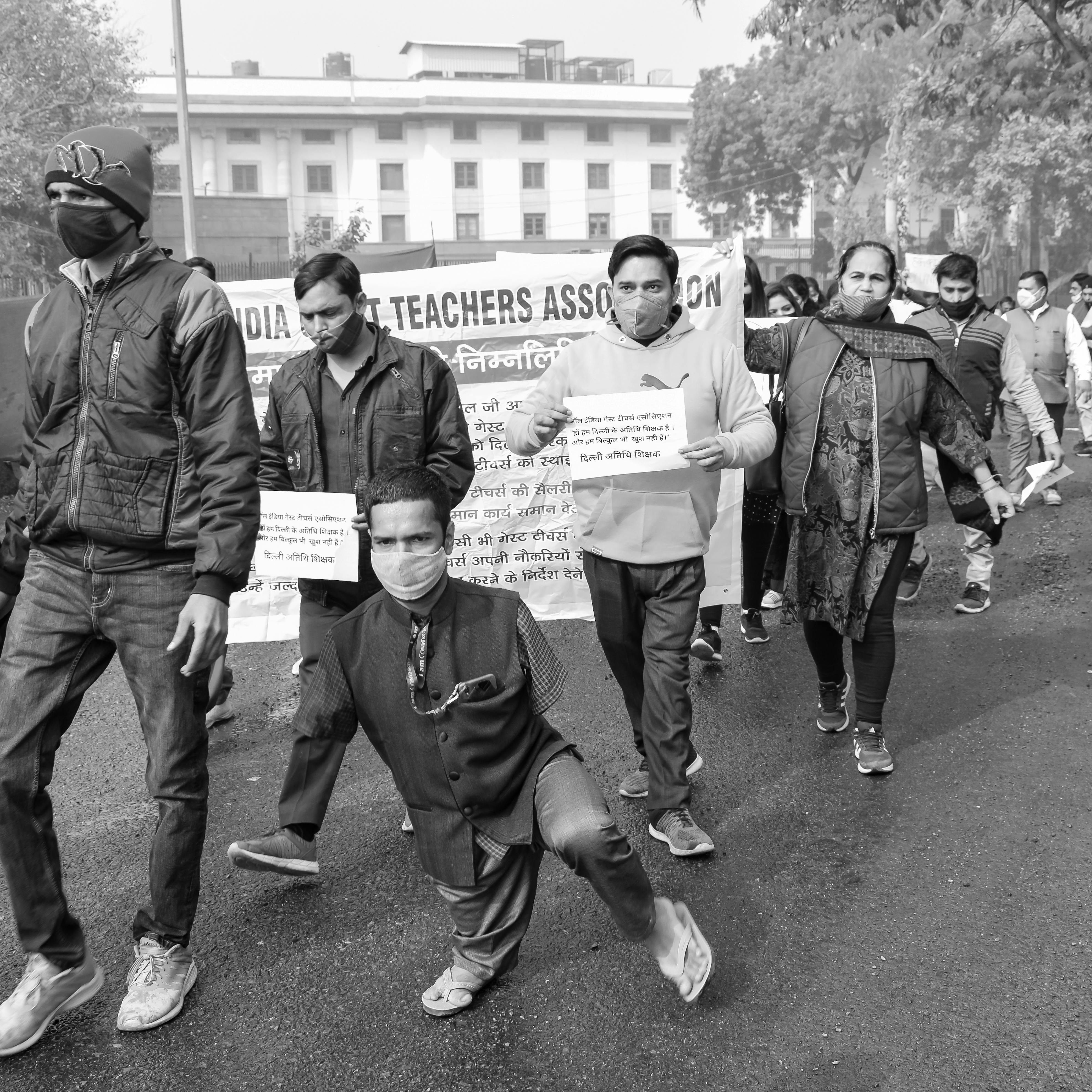 Person Wearing Mask and Jacket Standing · Free Stock Photo