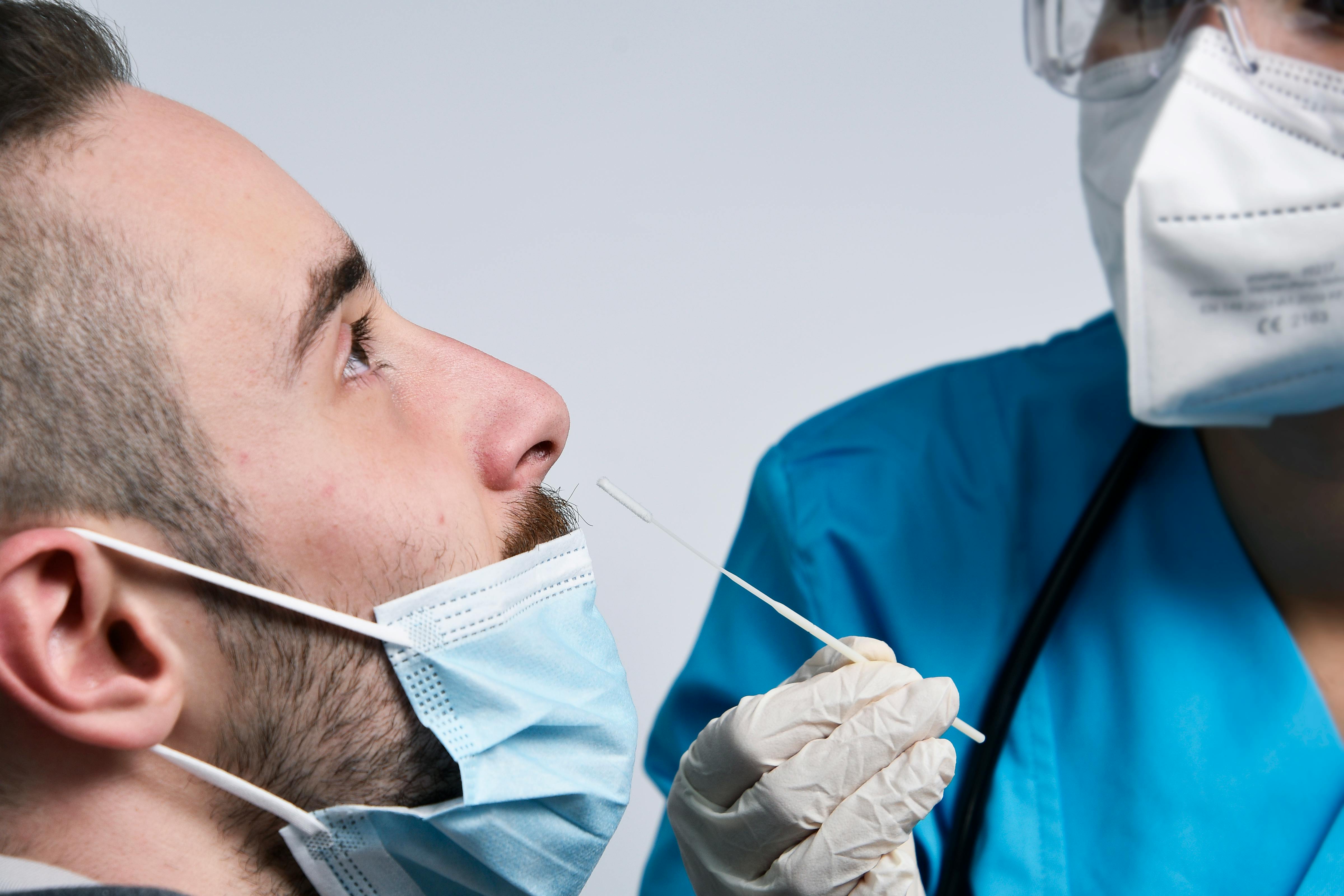 A Doctor doing a Medical Examination on an Elderly Man at Home · Free ...
