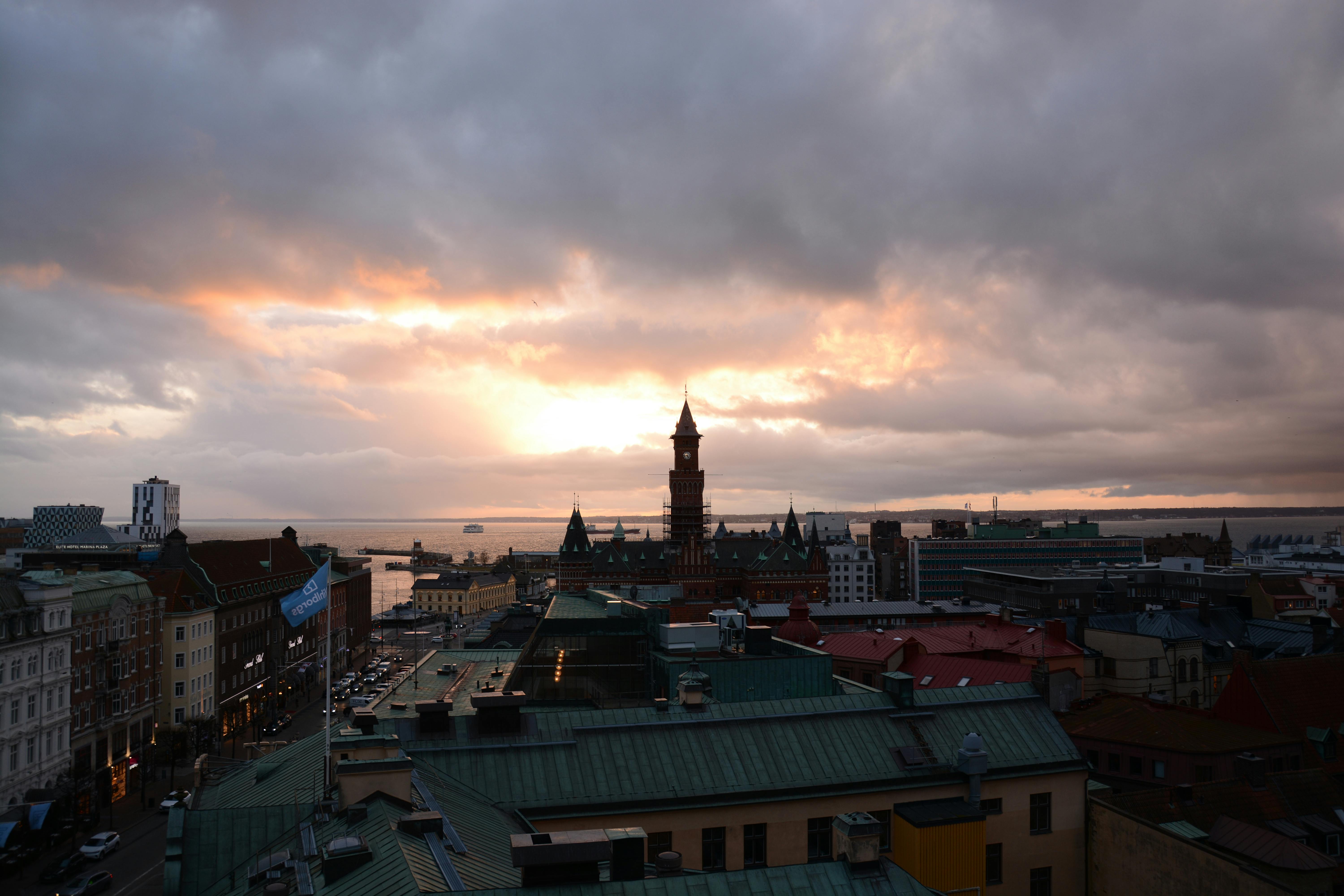 Man Looking at Sunset from Rooftop · Free Stock Photo
