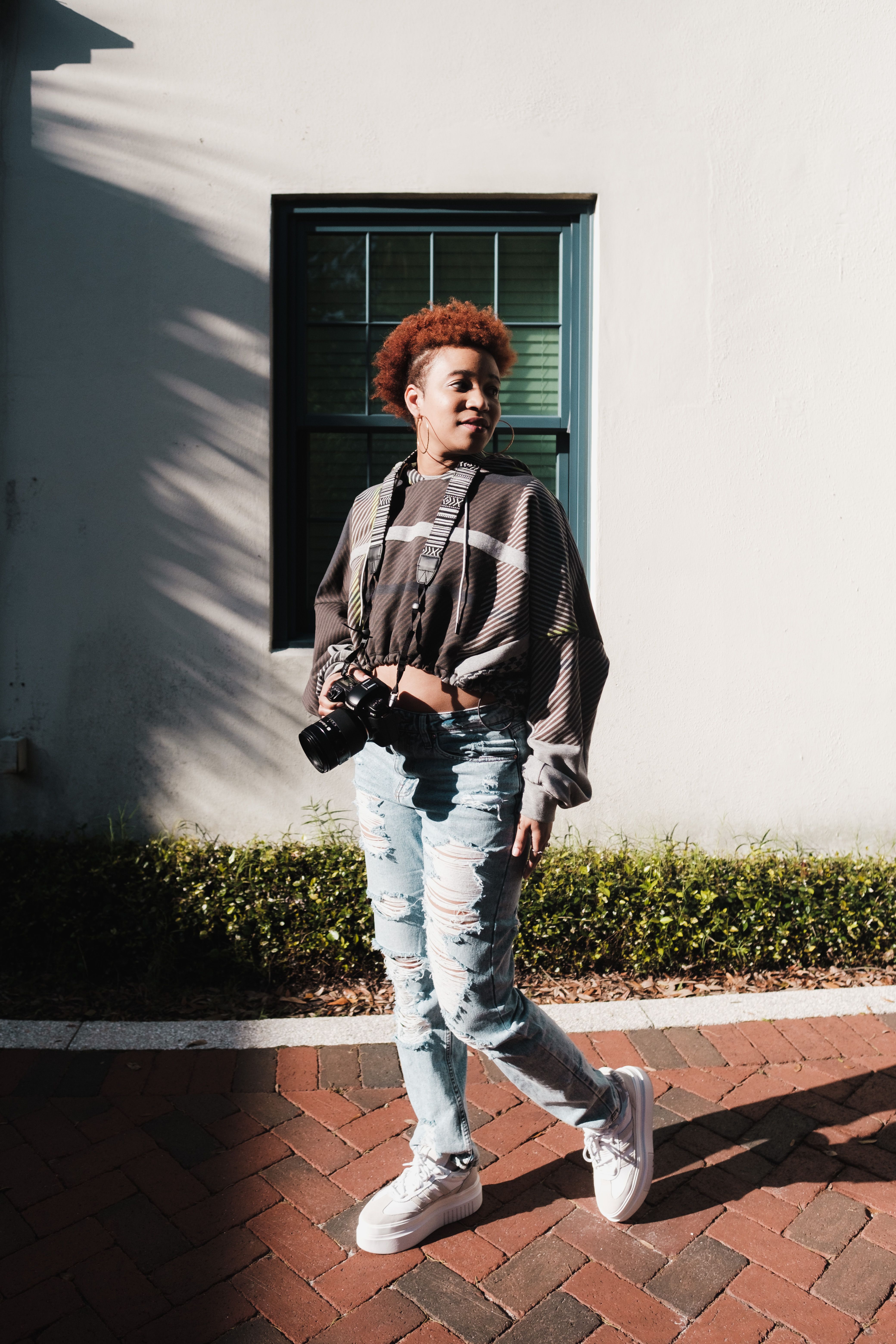 Female Photographer Posing with her Camera · Free Stock Photo