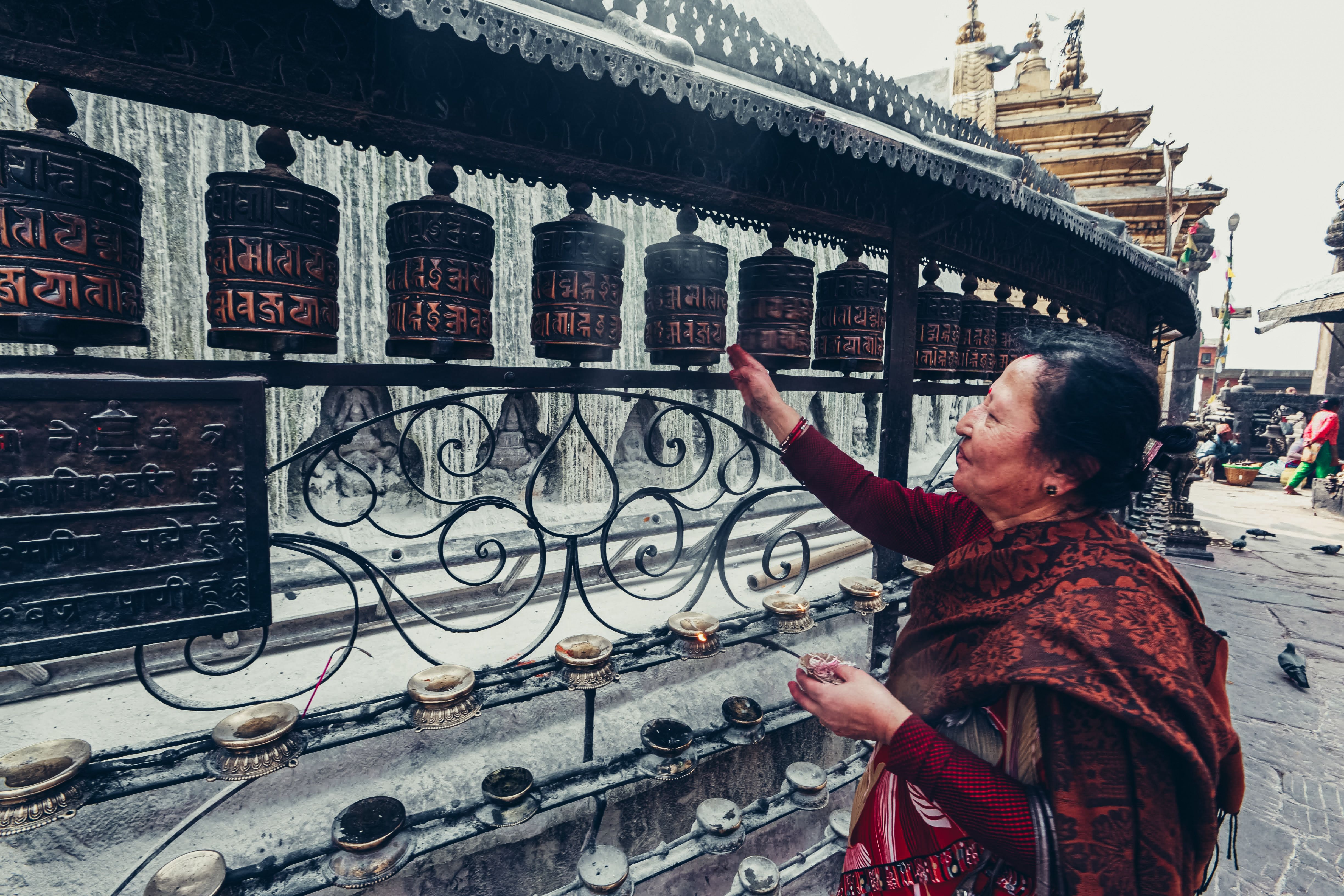 Woman in Traditional Clothing near Temple · Free Stock Photo