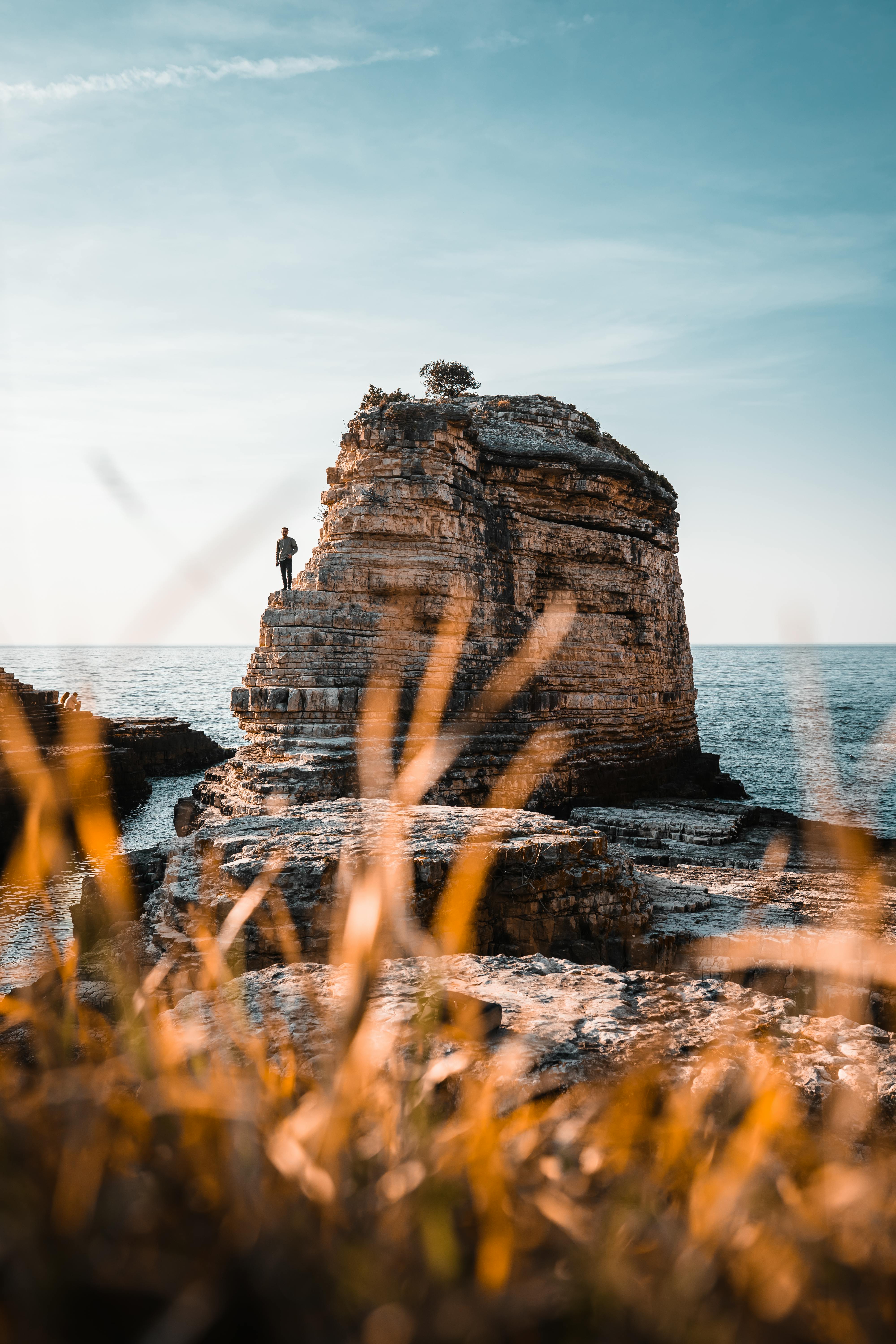 Lone Rock on Beach Overlooking Sea · Free Stock Photo