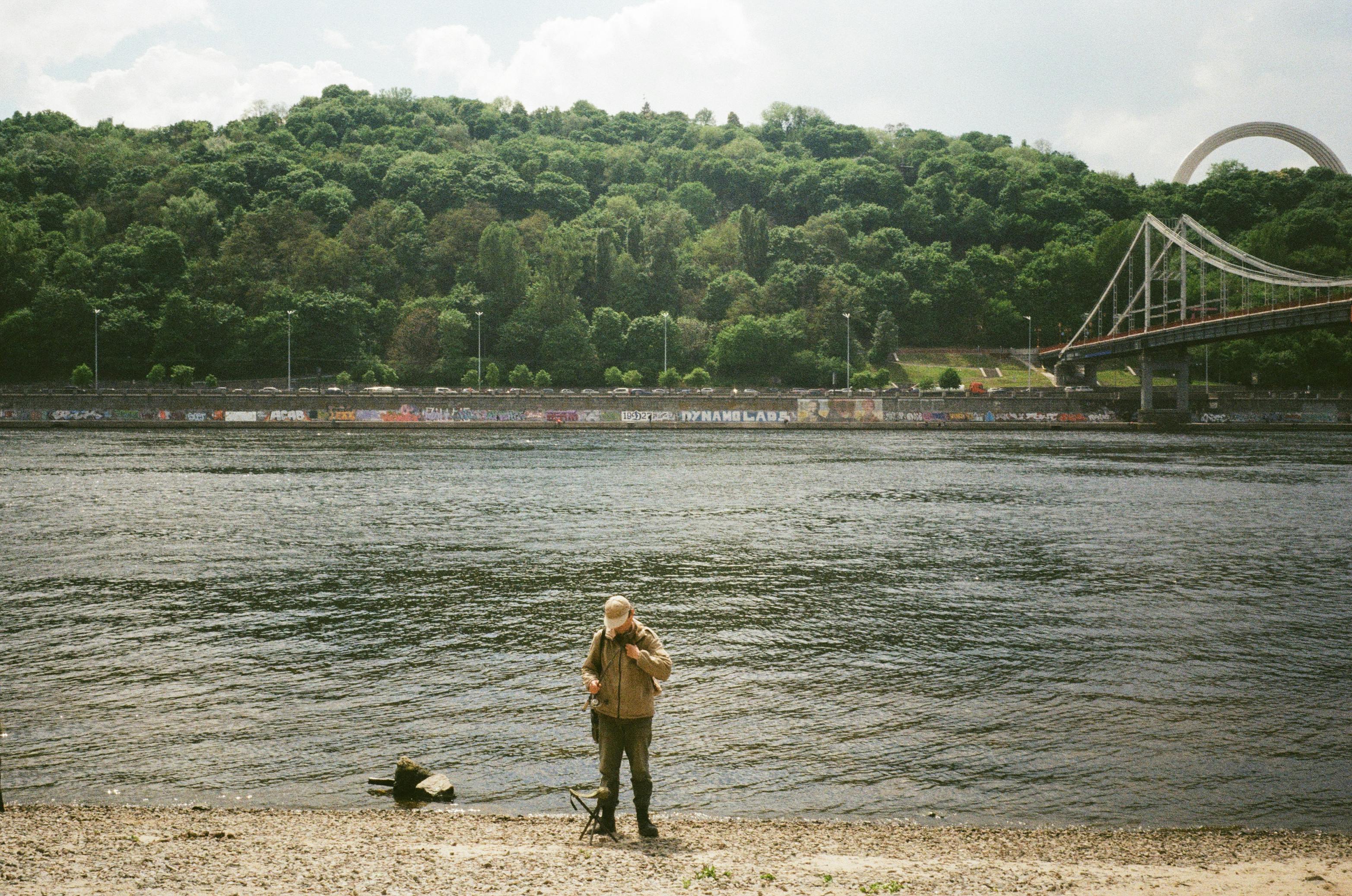 Person Standing on a River Bank · Free Stock Photo