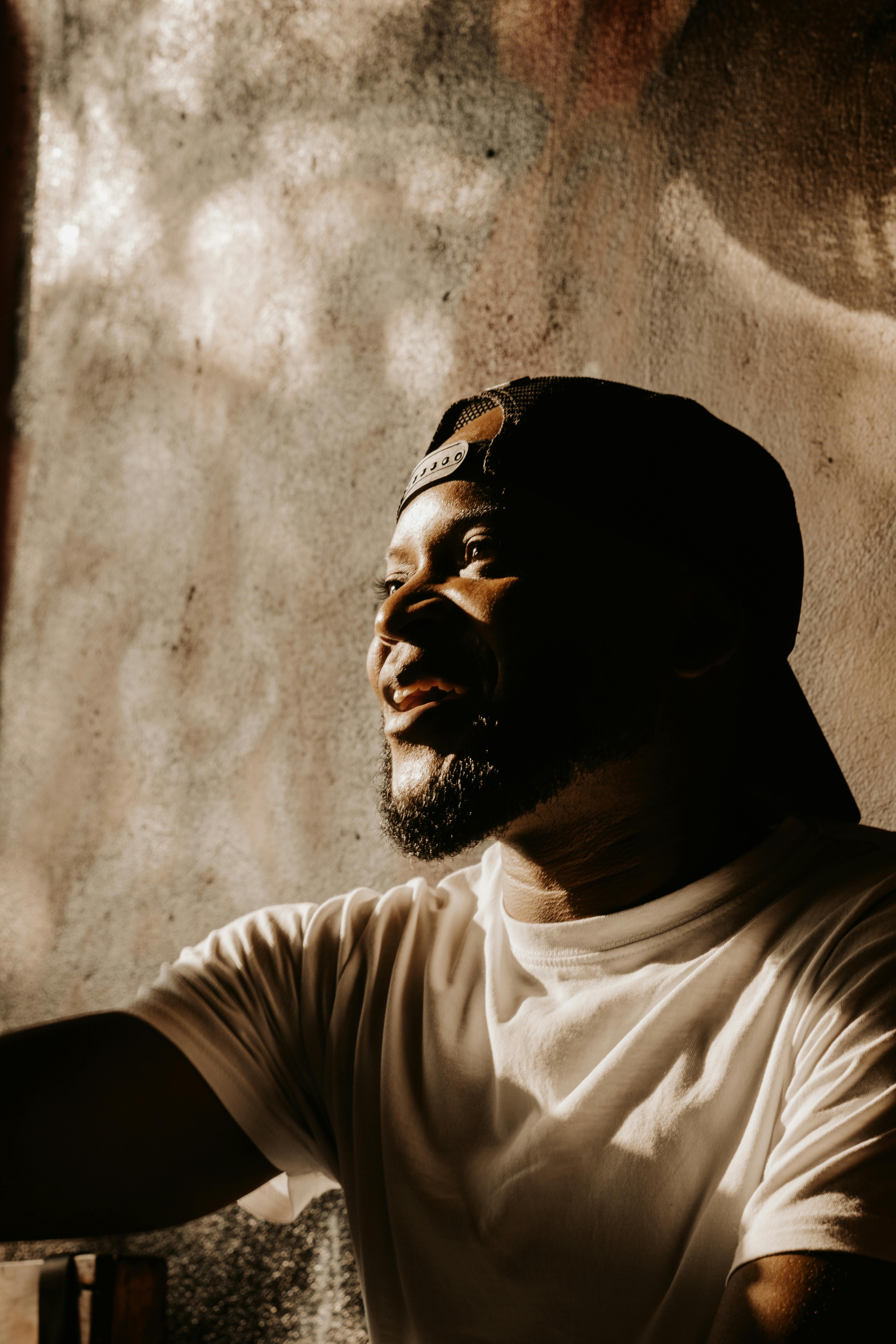 Close Up Photo of Man Wearing White Cap · Free Stock Photo