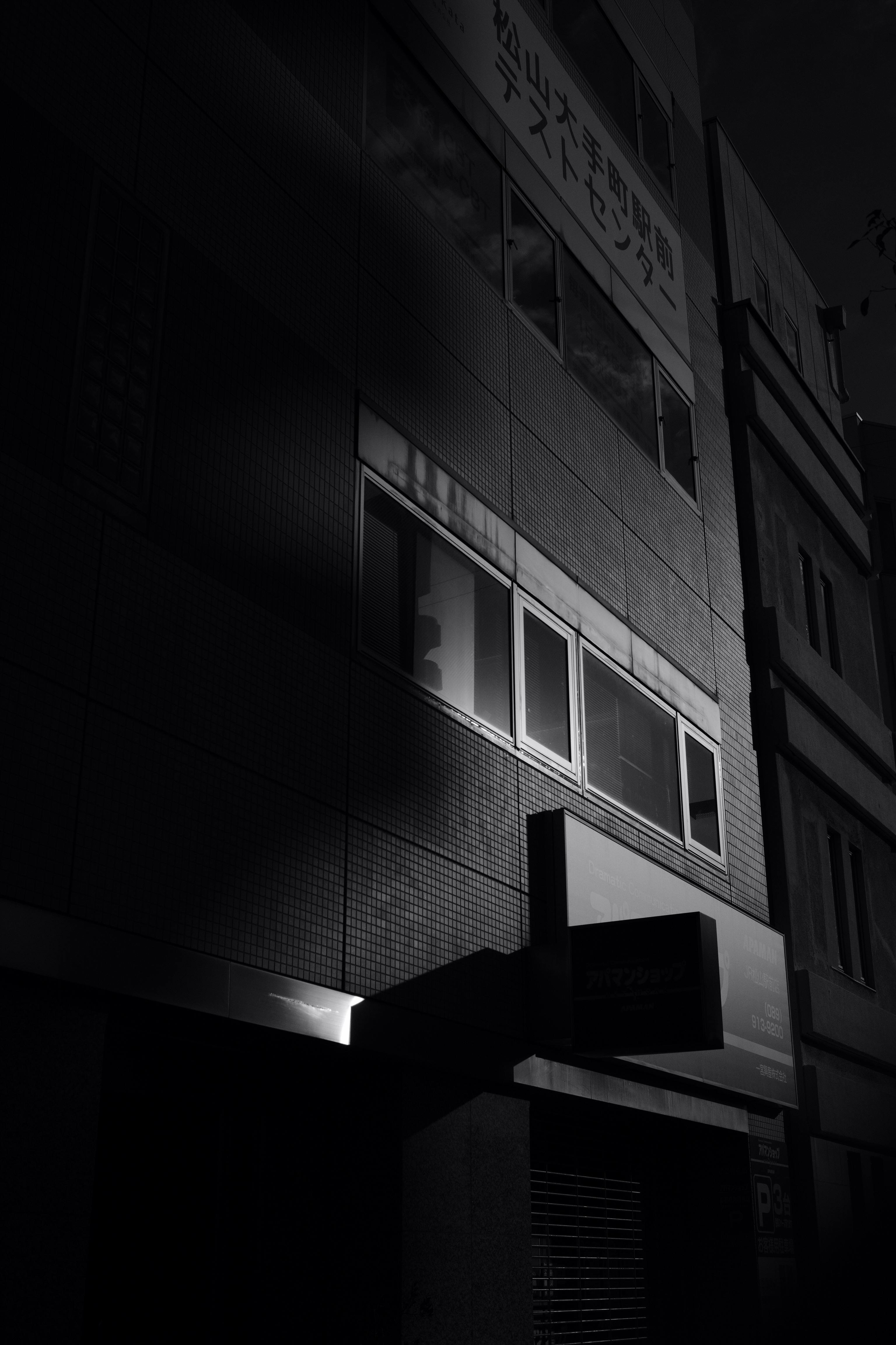 Grayscale Photo of Concrete Building · Free Stock Photo