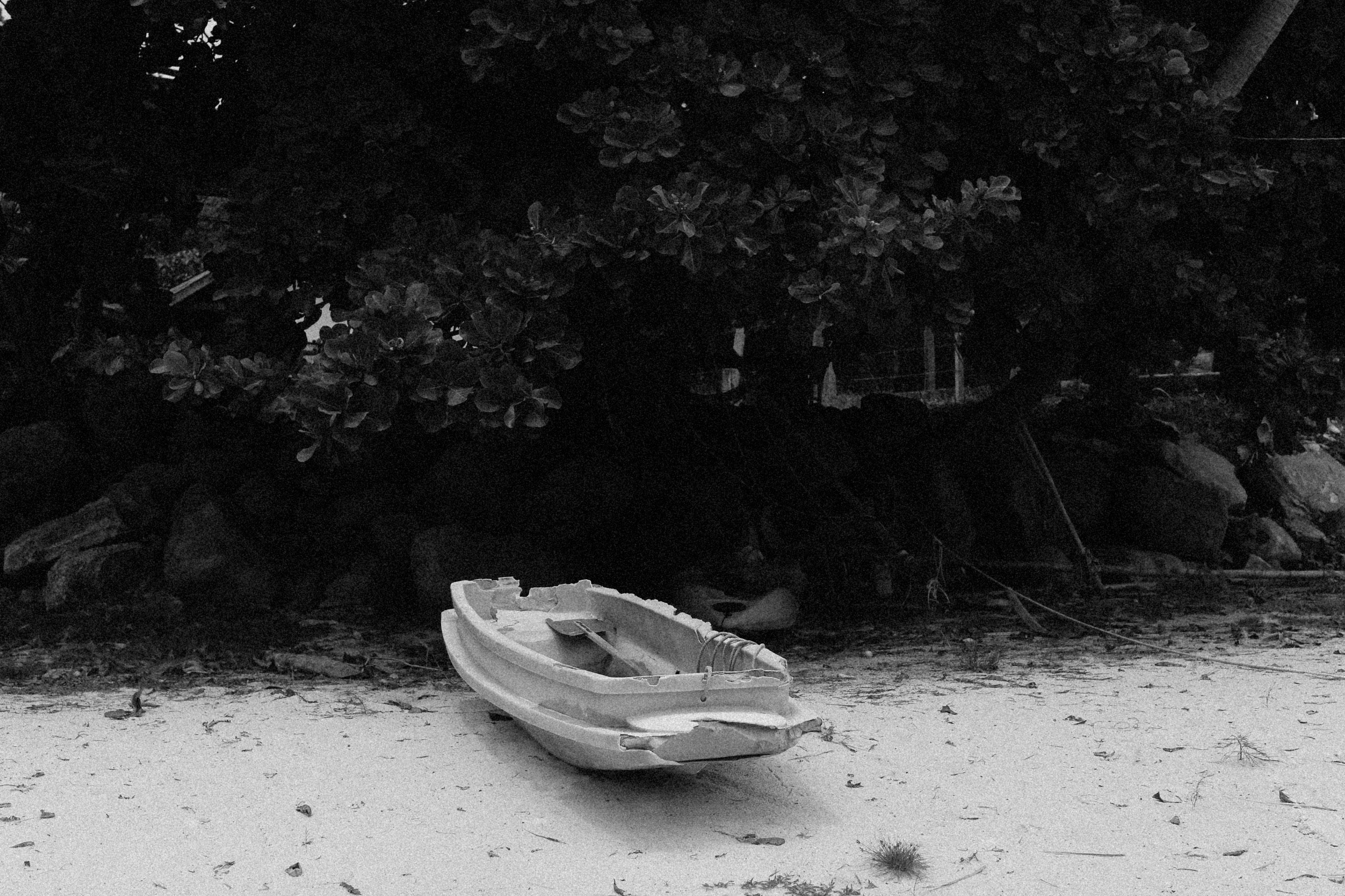 Grayscale Photography of a Boat Near the Lake · Free Stock Photo