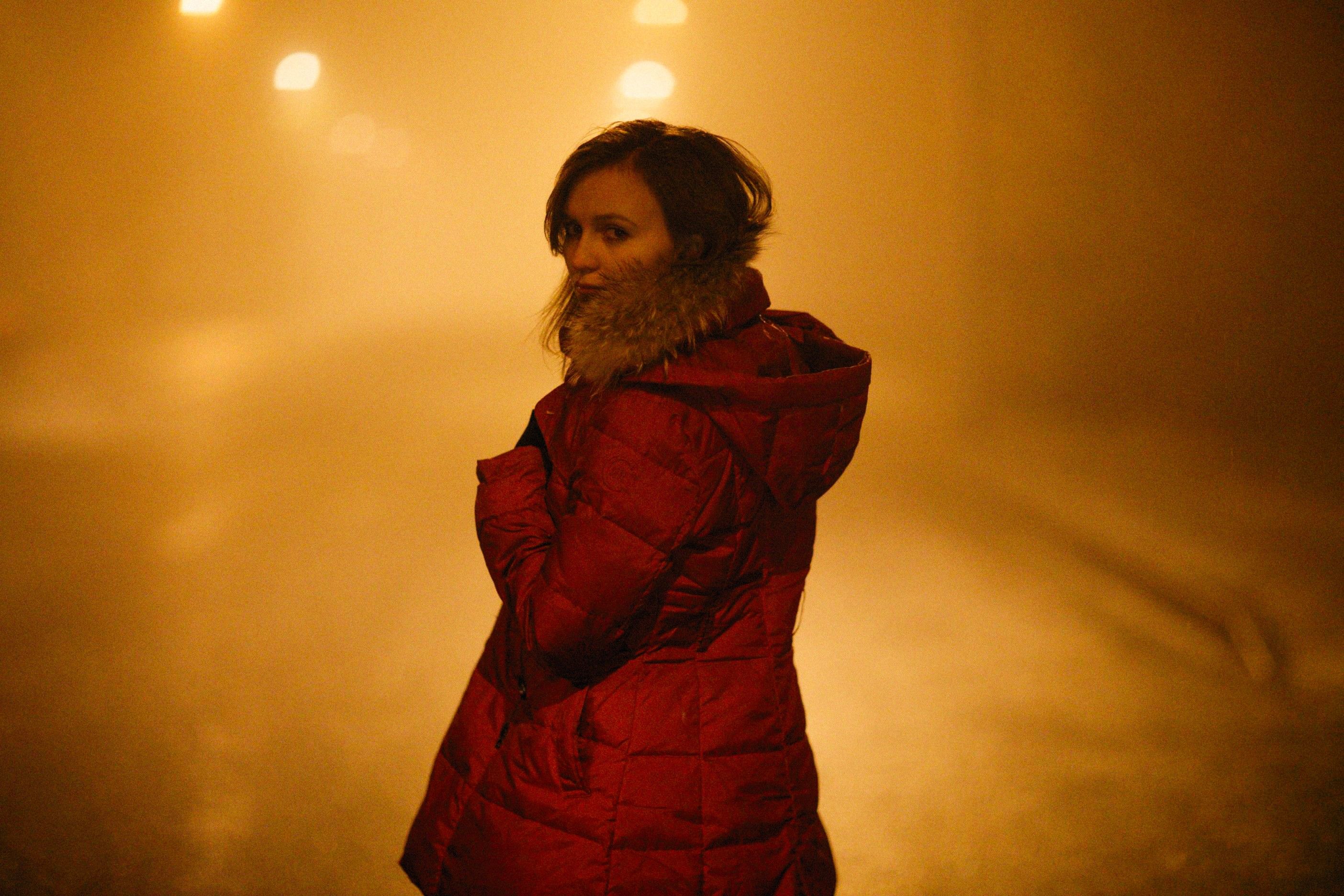 Woman in Red Bubble Jacket · Free Stock Photo