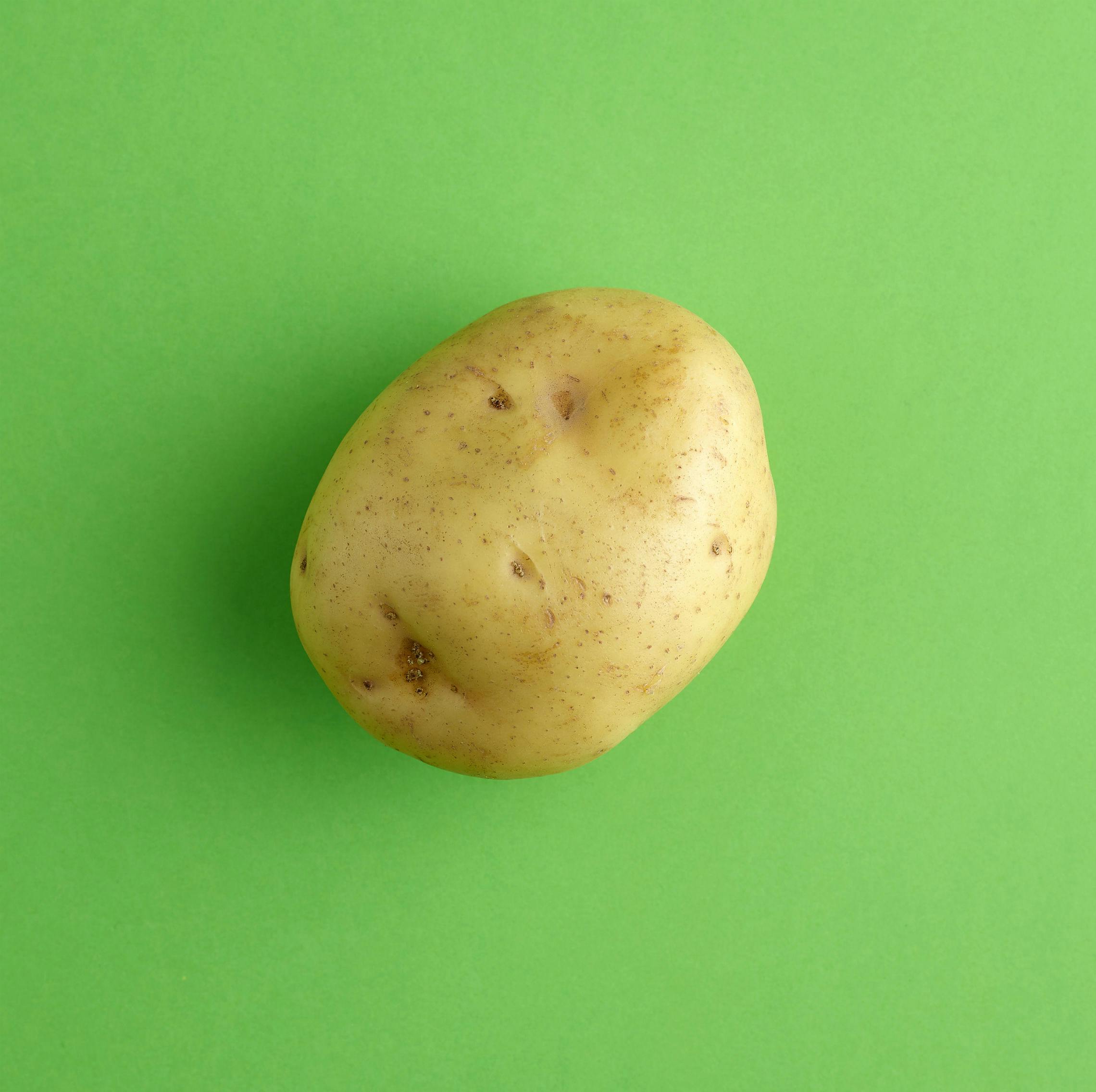 Throwing Potatoes from Bucket · Free Stock Photo