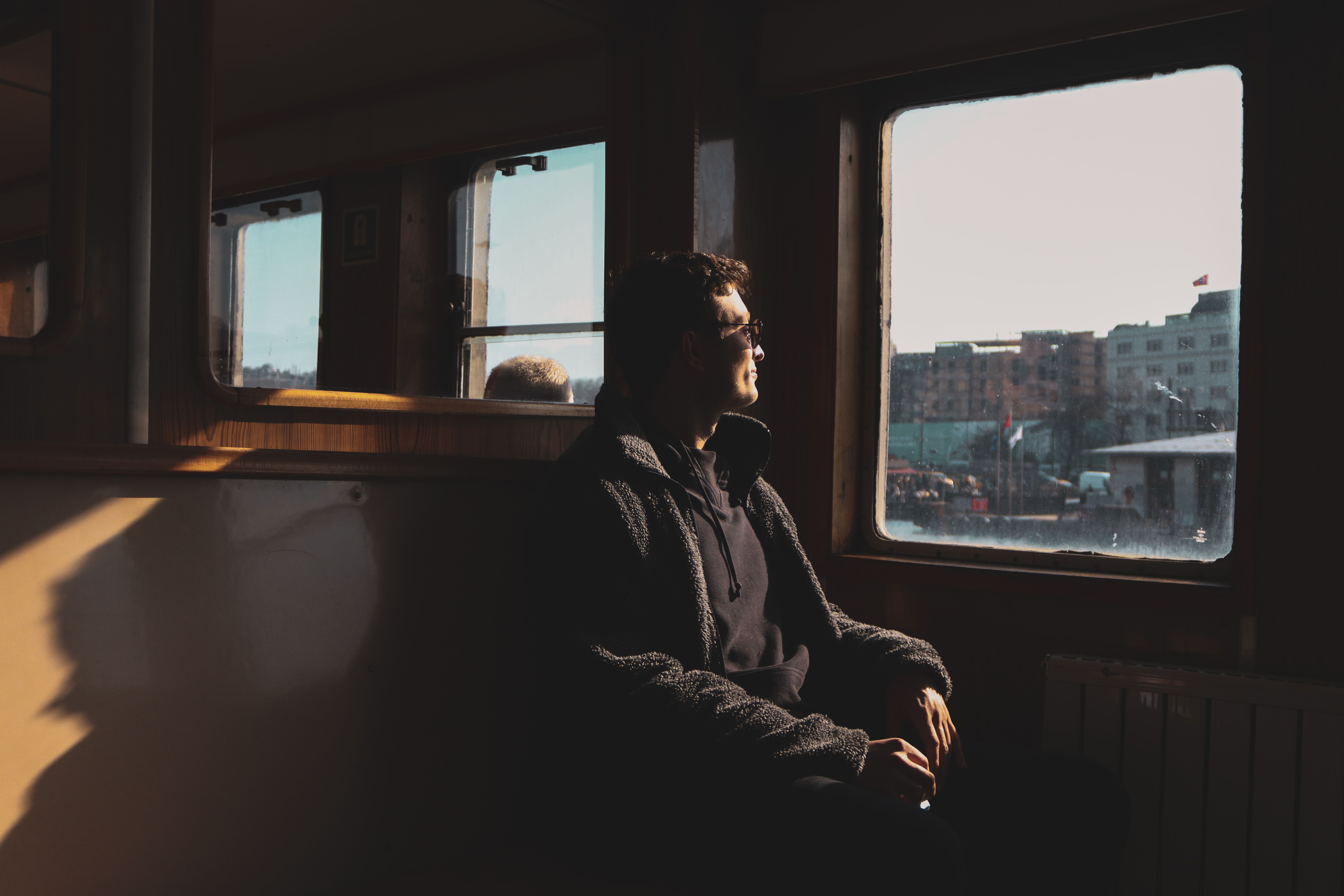 Man Sitting Inside a Train · Free Stock Photo