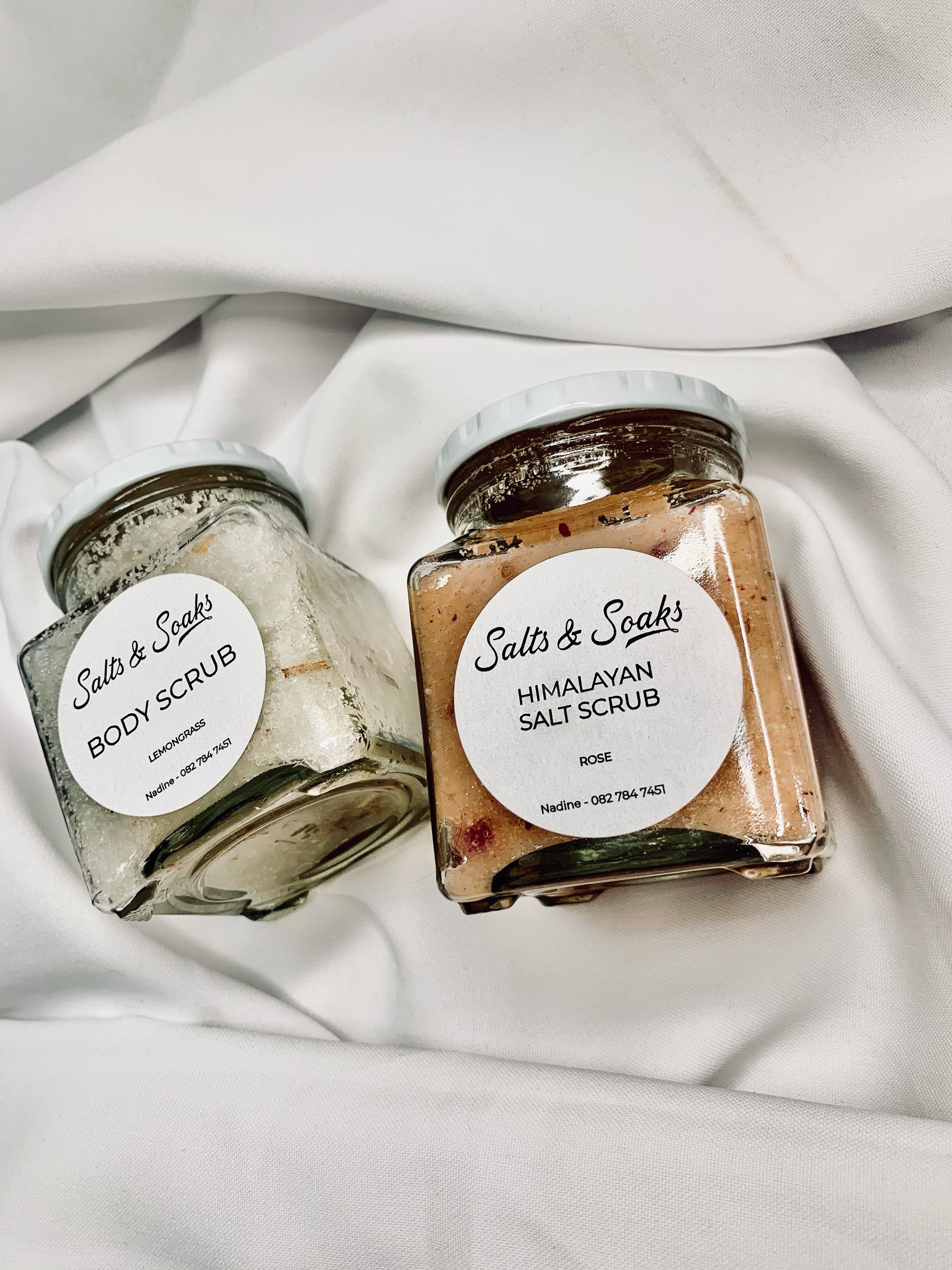 Person holding a Brand of Body Scrub · Free Stock Photo