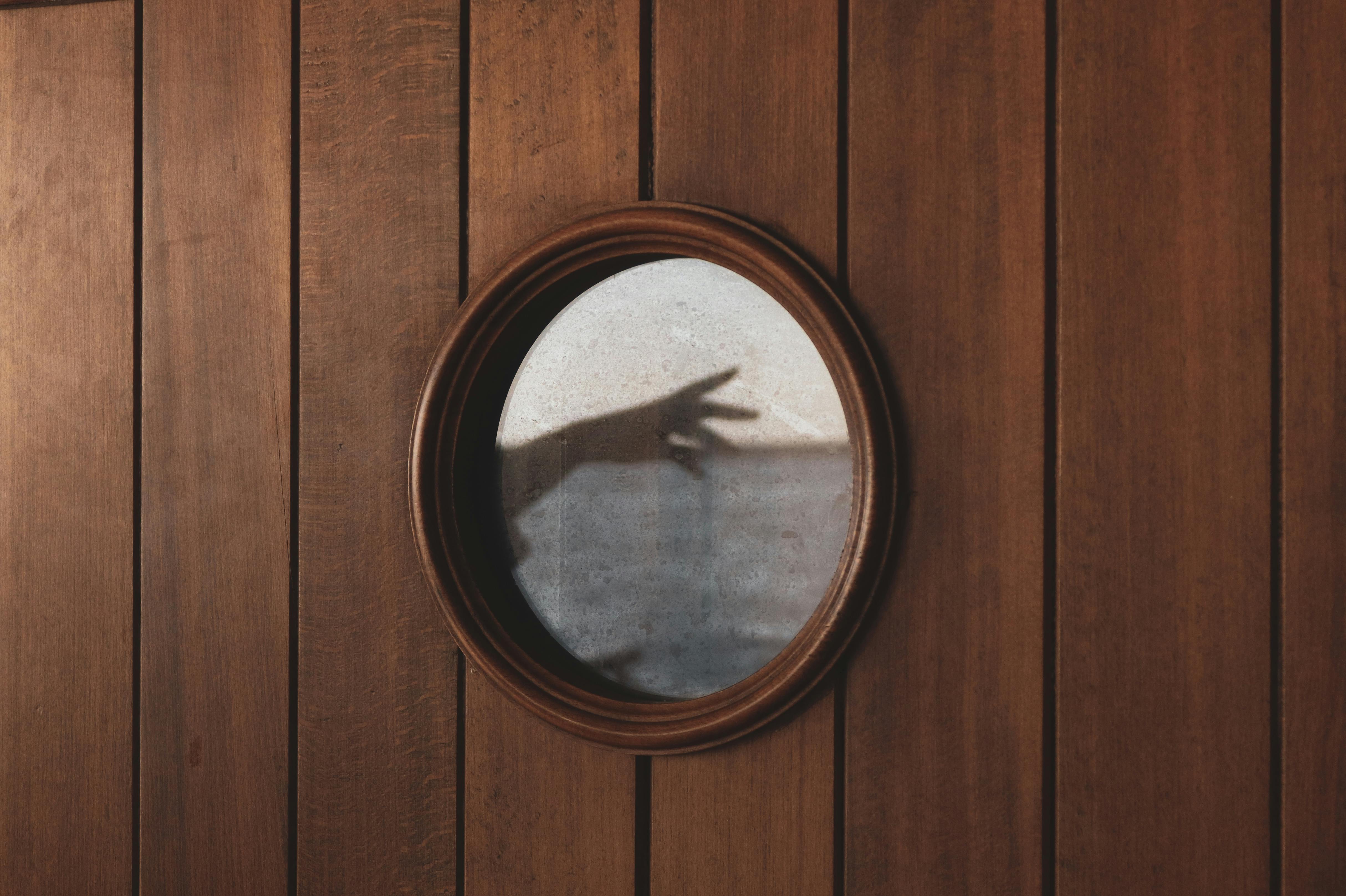 Round Brown Wooden Framed Mirror · Free Stock Photo