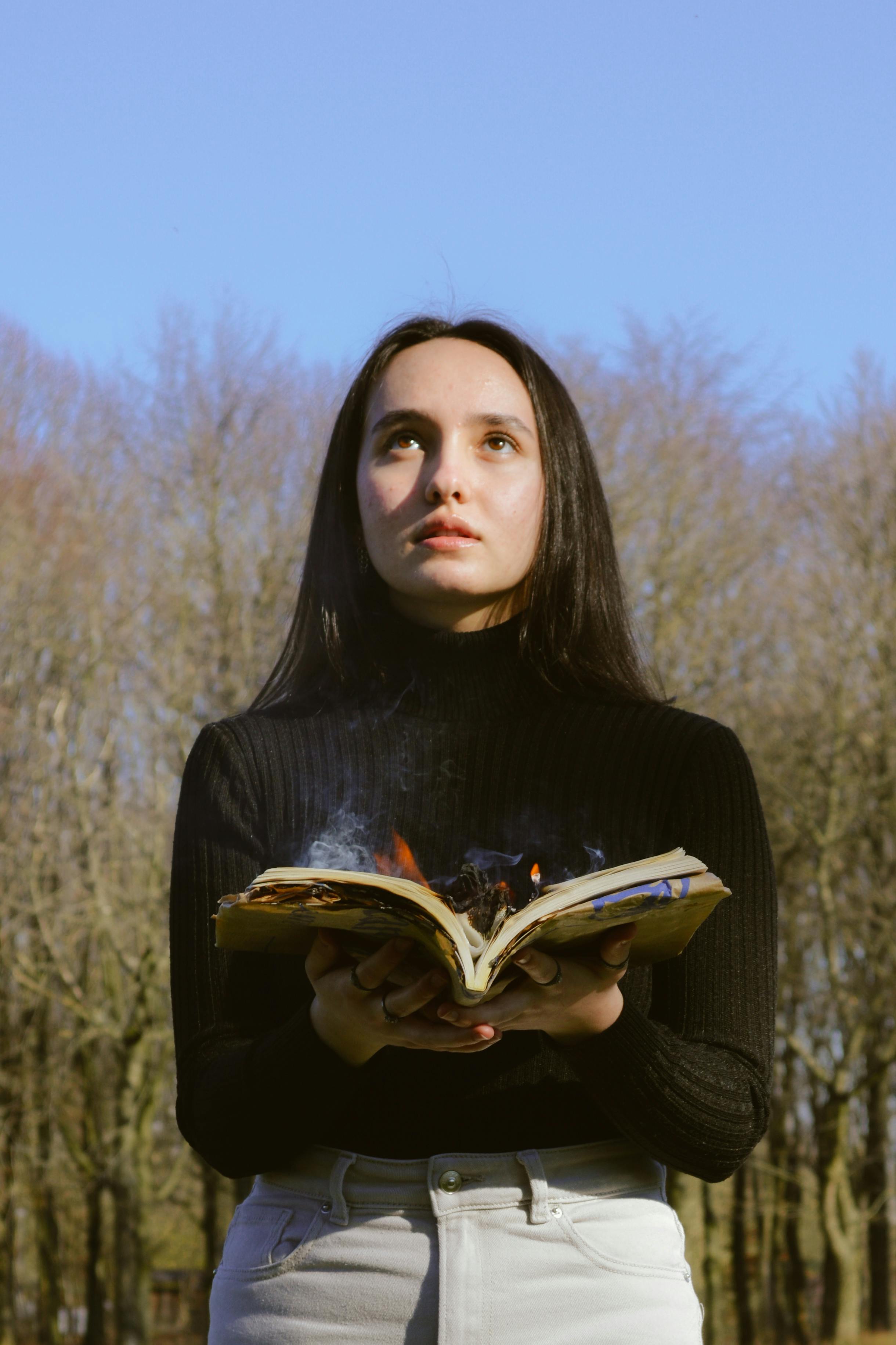 Woman Getting a Book on Shelves · Free Stock Photo