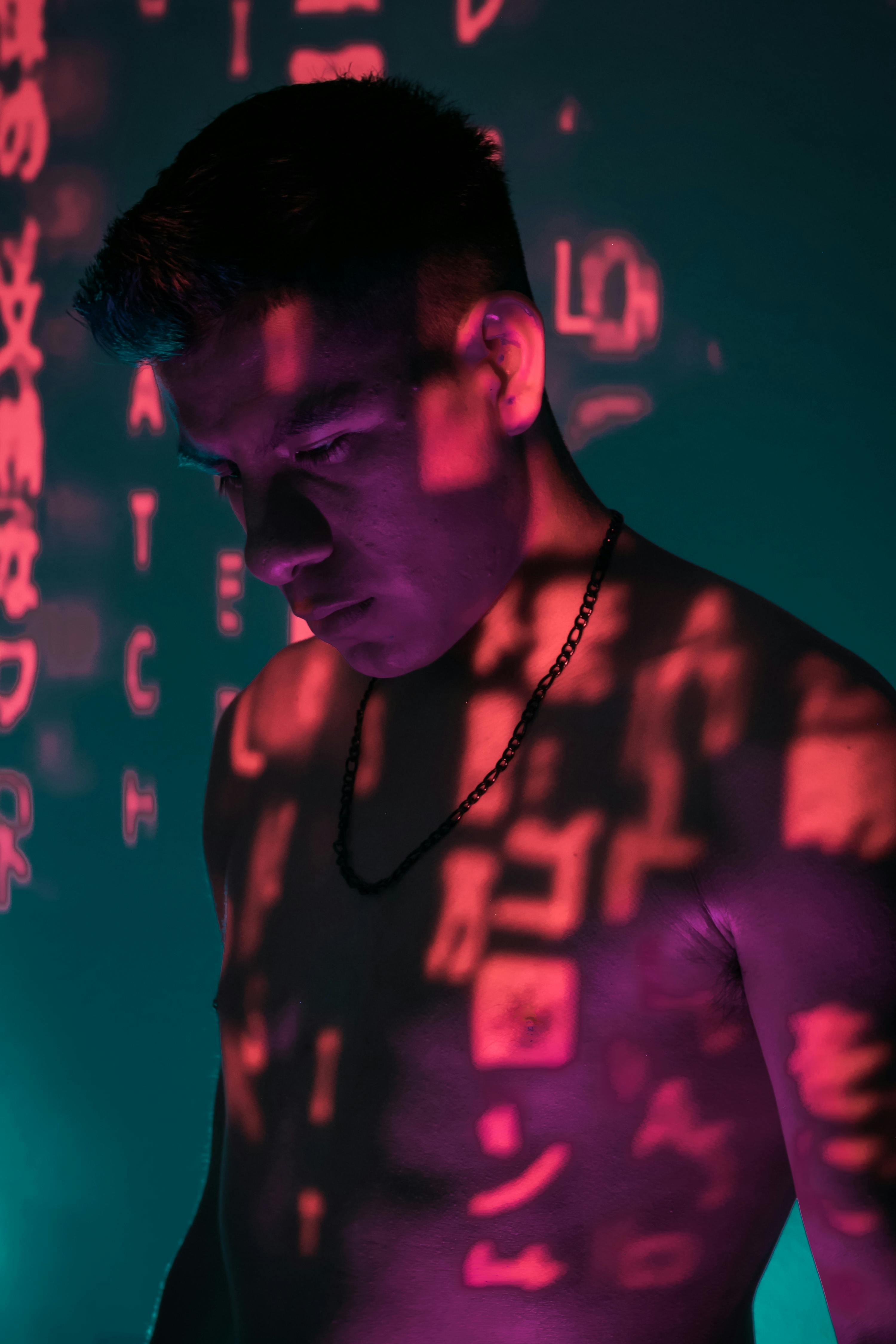 Portrait of a Man with Letters Projected on his Body · Free Stock Photo