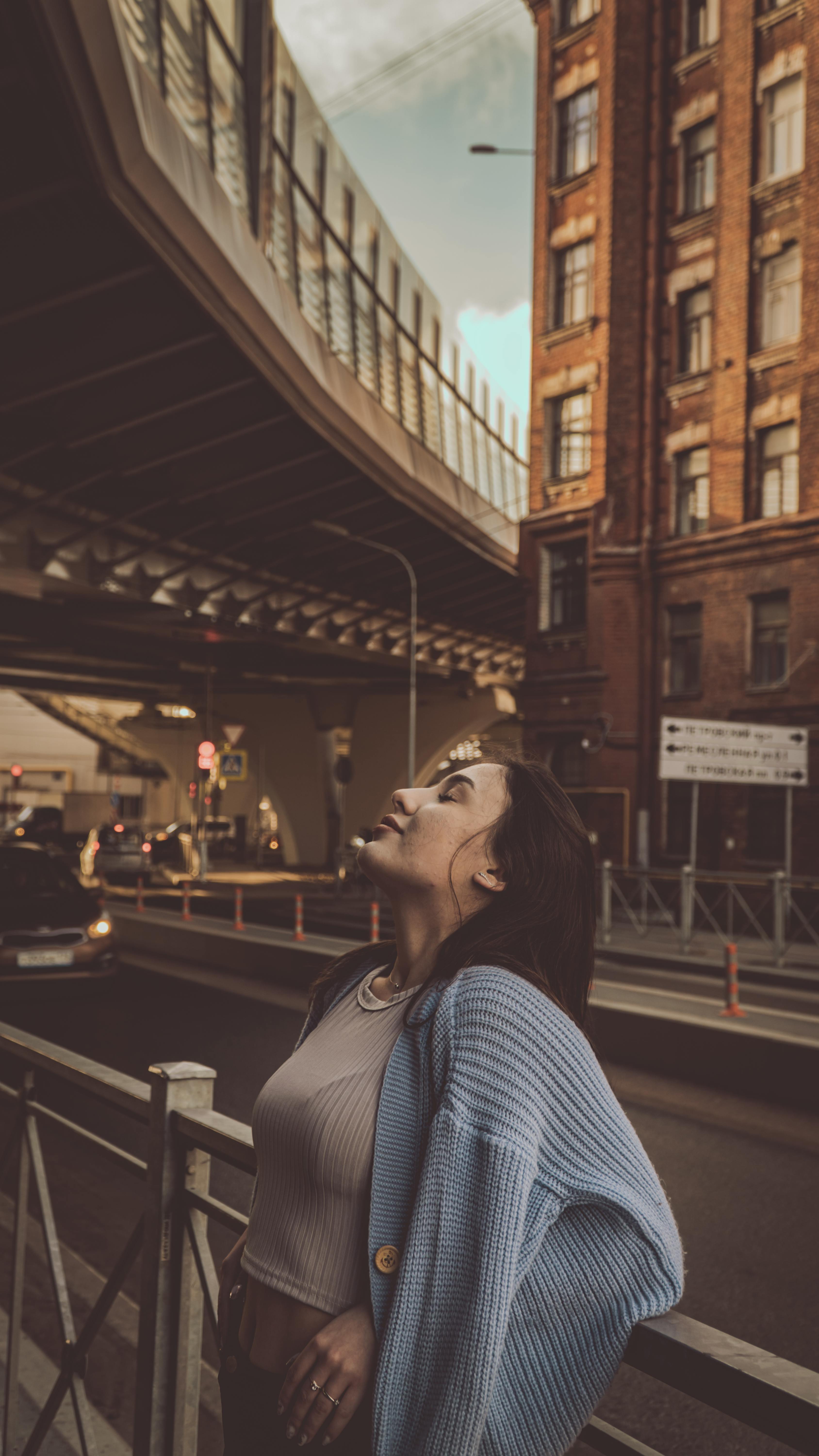 Woman Leaning on a Railing · Free Stock Photo