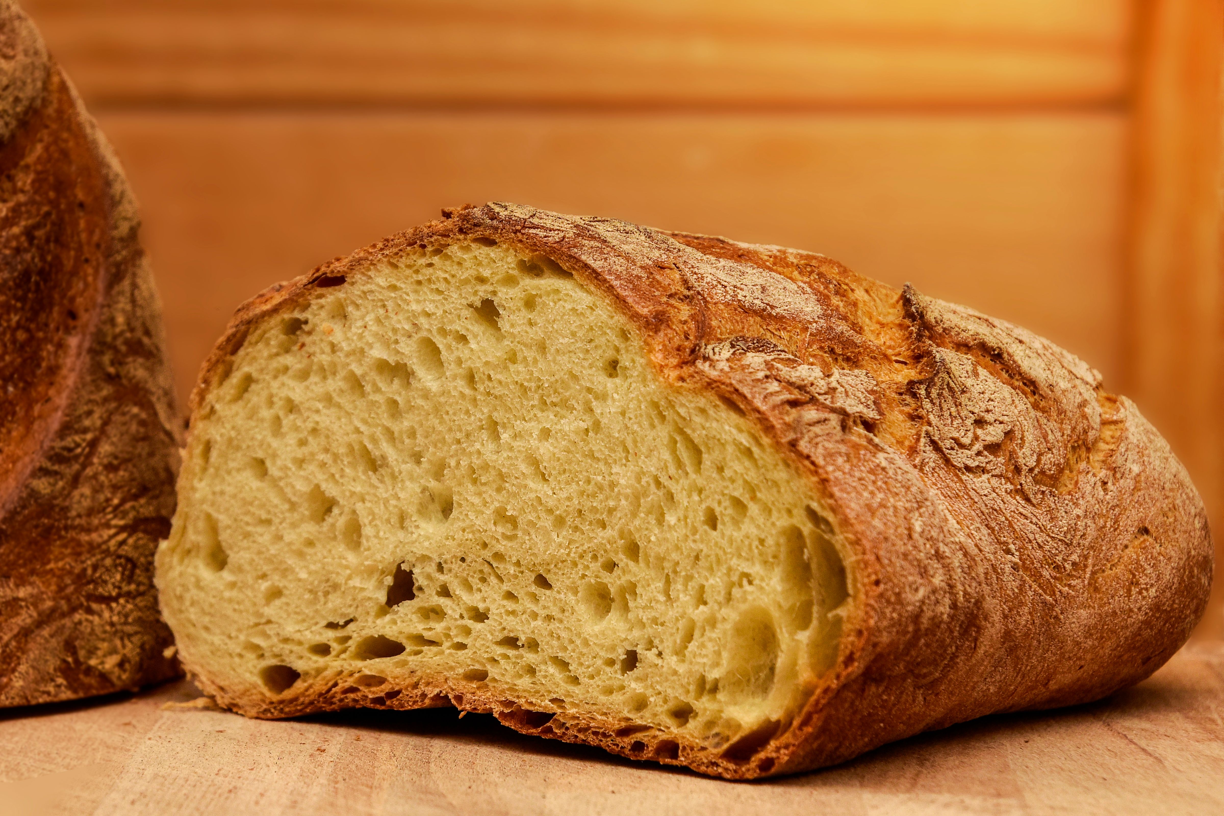 Person Holding a Sourdough Bread · Free Stock Photo