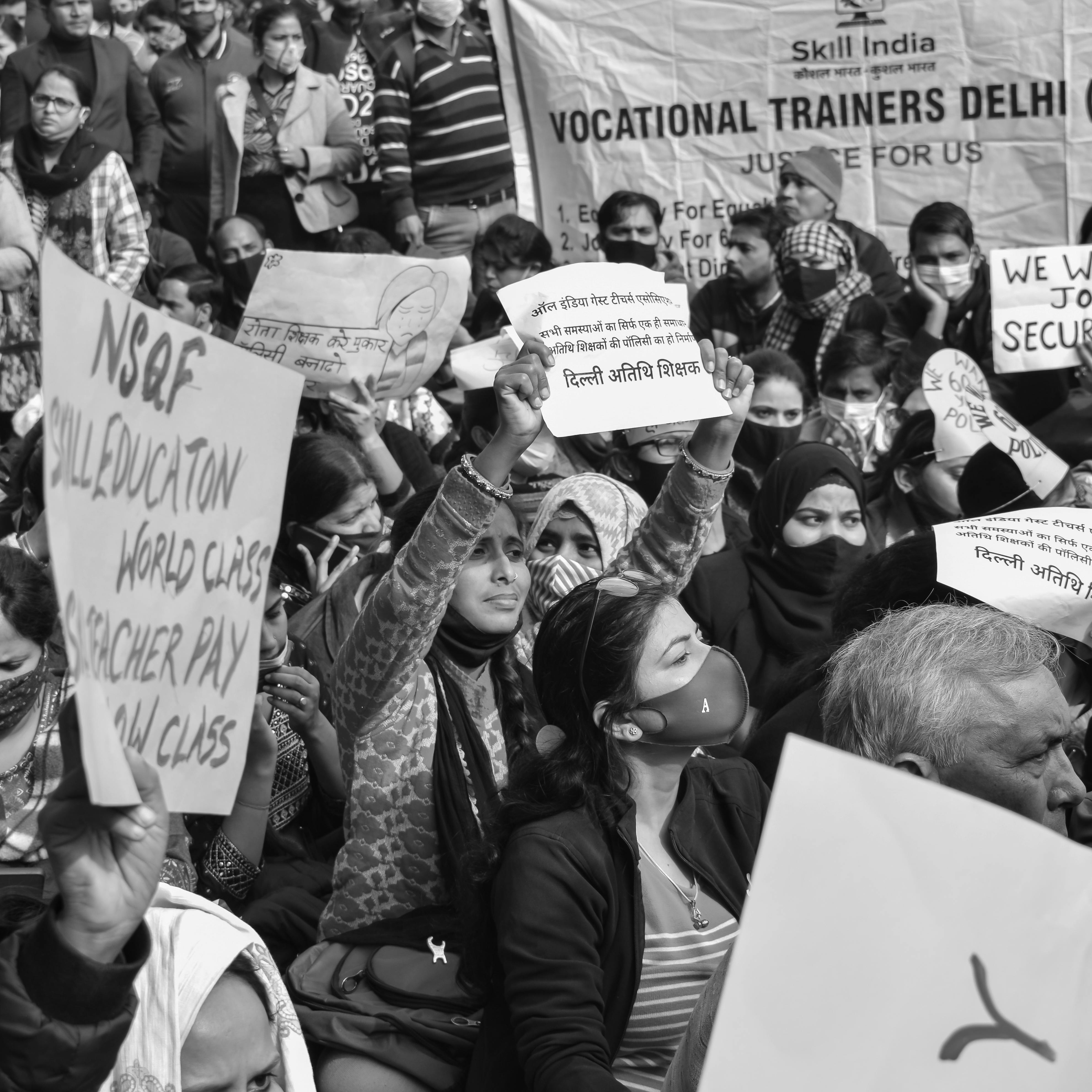 A Grayscale Photo of People Protesting · Free Stock Photo