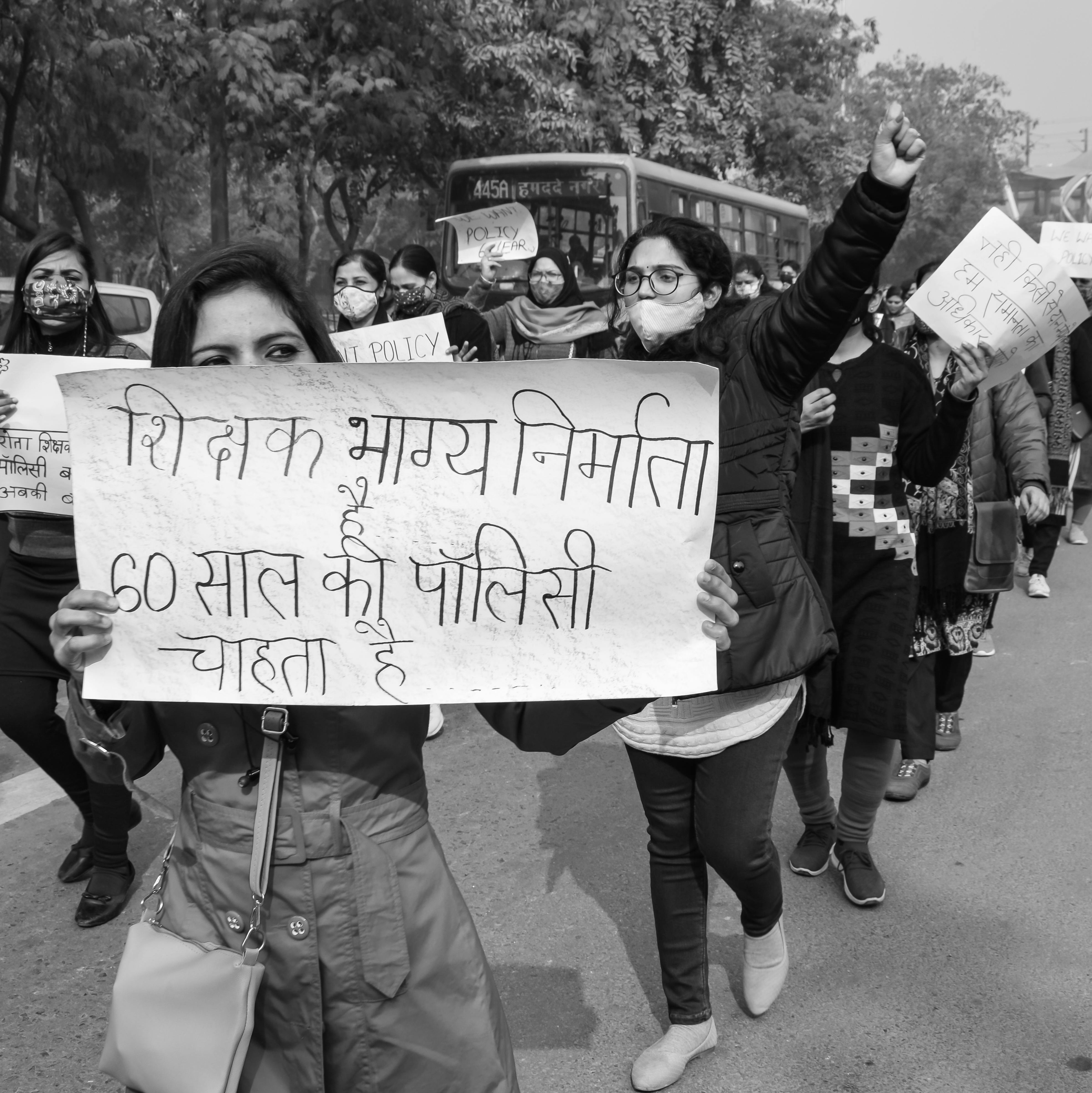 Crowd Raising Posters with Message · Free Stock Photo