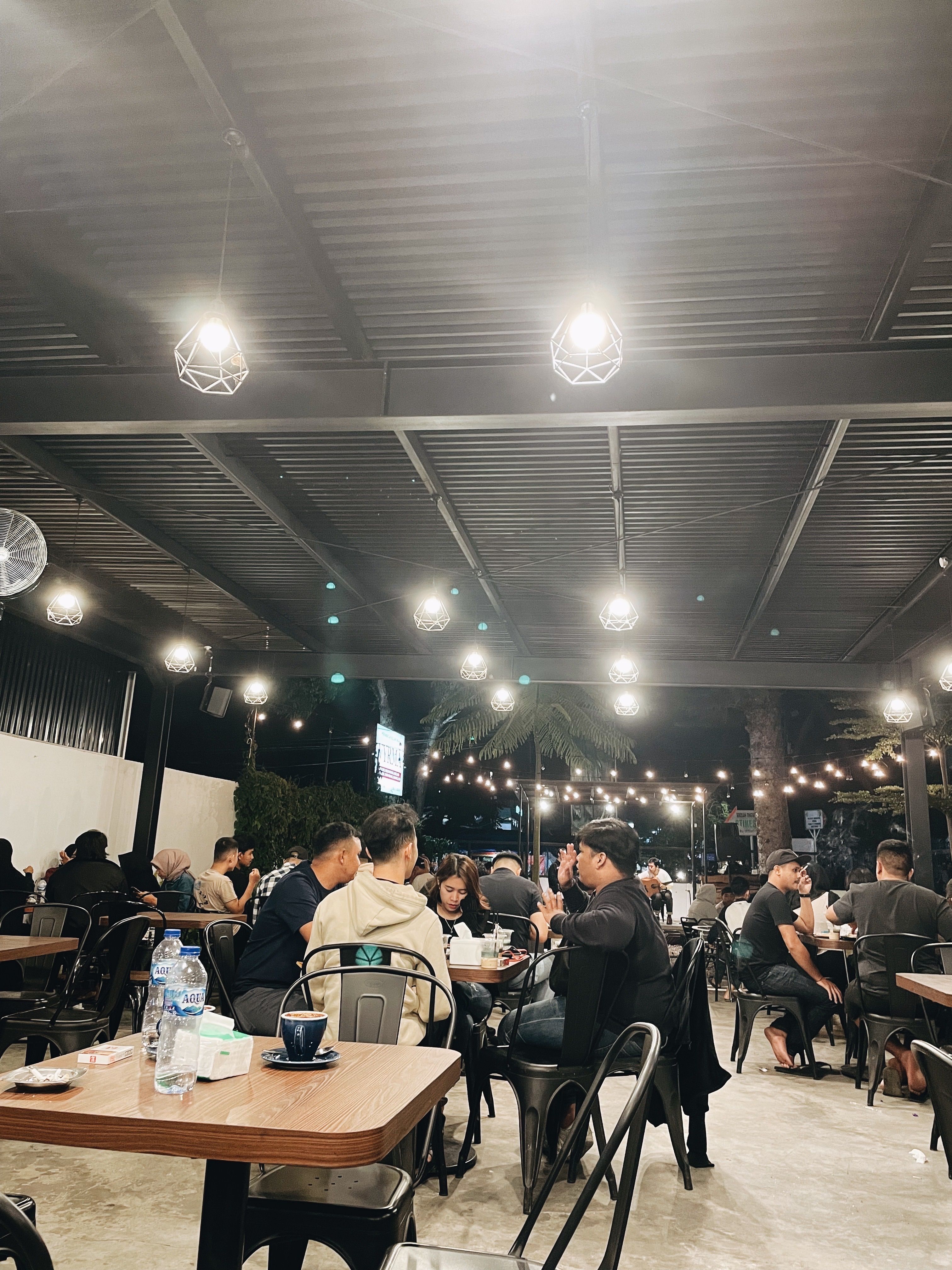 People Sitting at Tables in Restaurant · Free Stock Photo