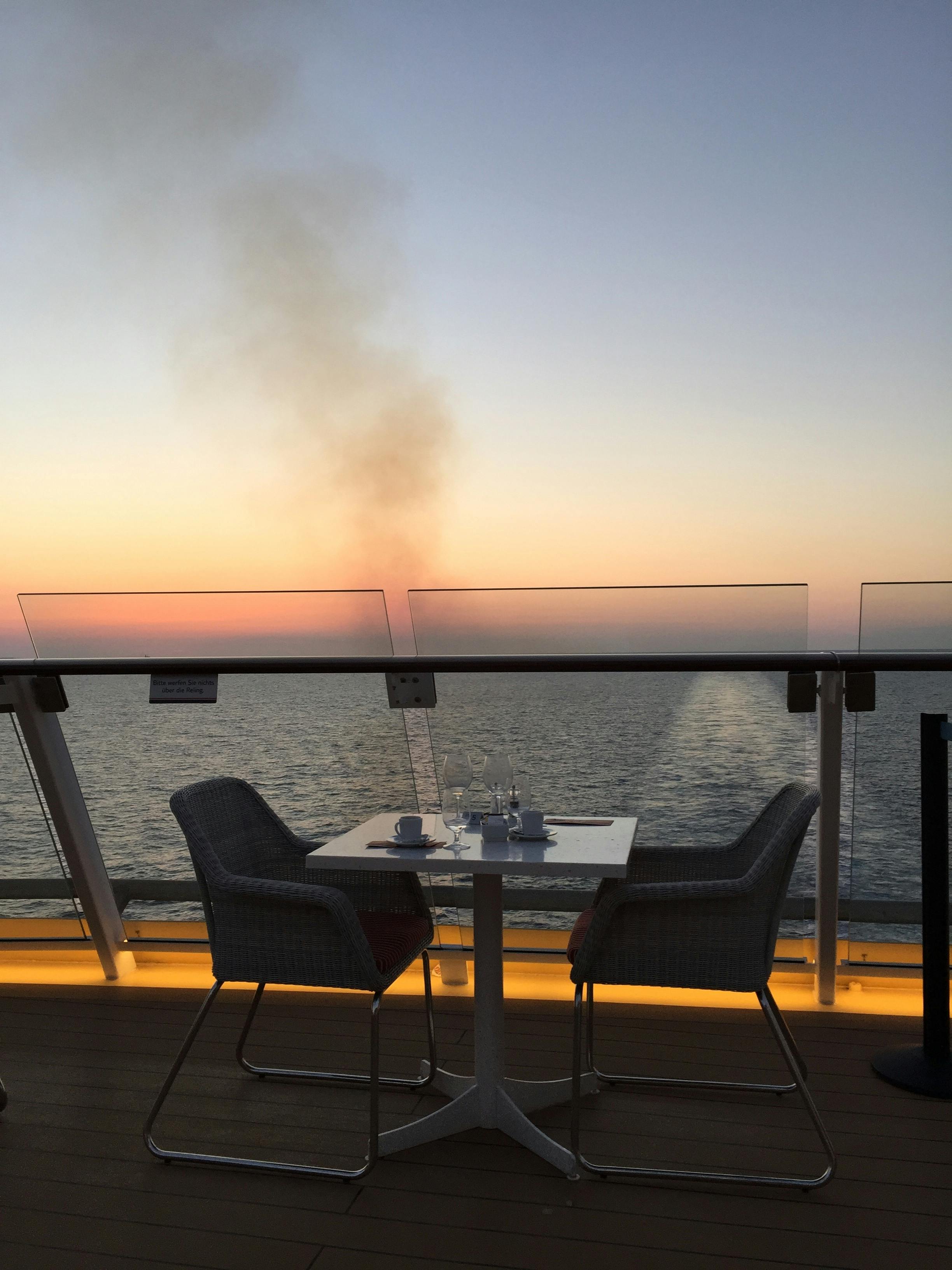 Table and Seats on a Terrace with the View of the Sea at Sunset · Free ...