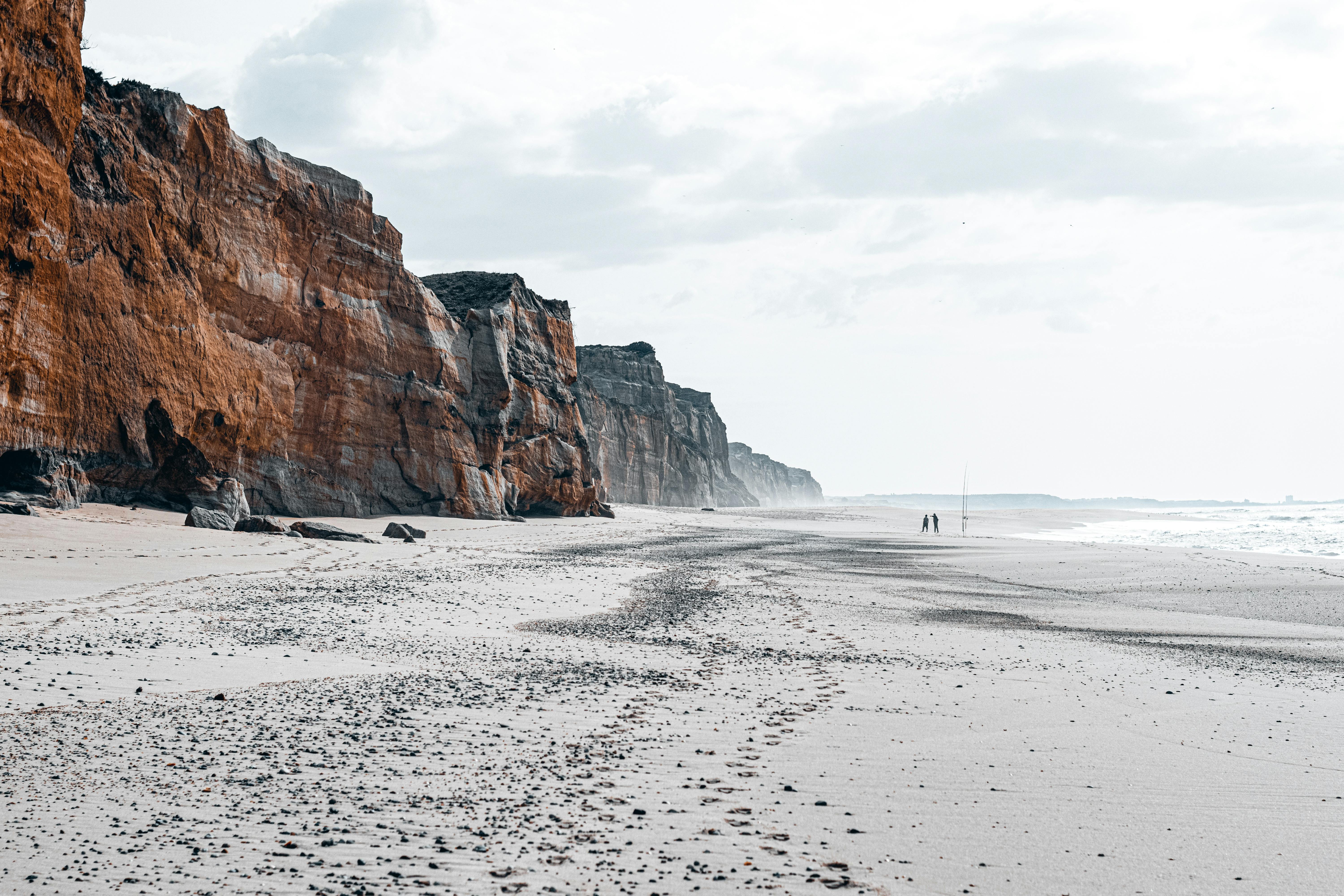 Cliff and Beach on Sea Shore · Free Stock Photo