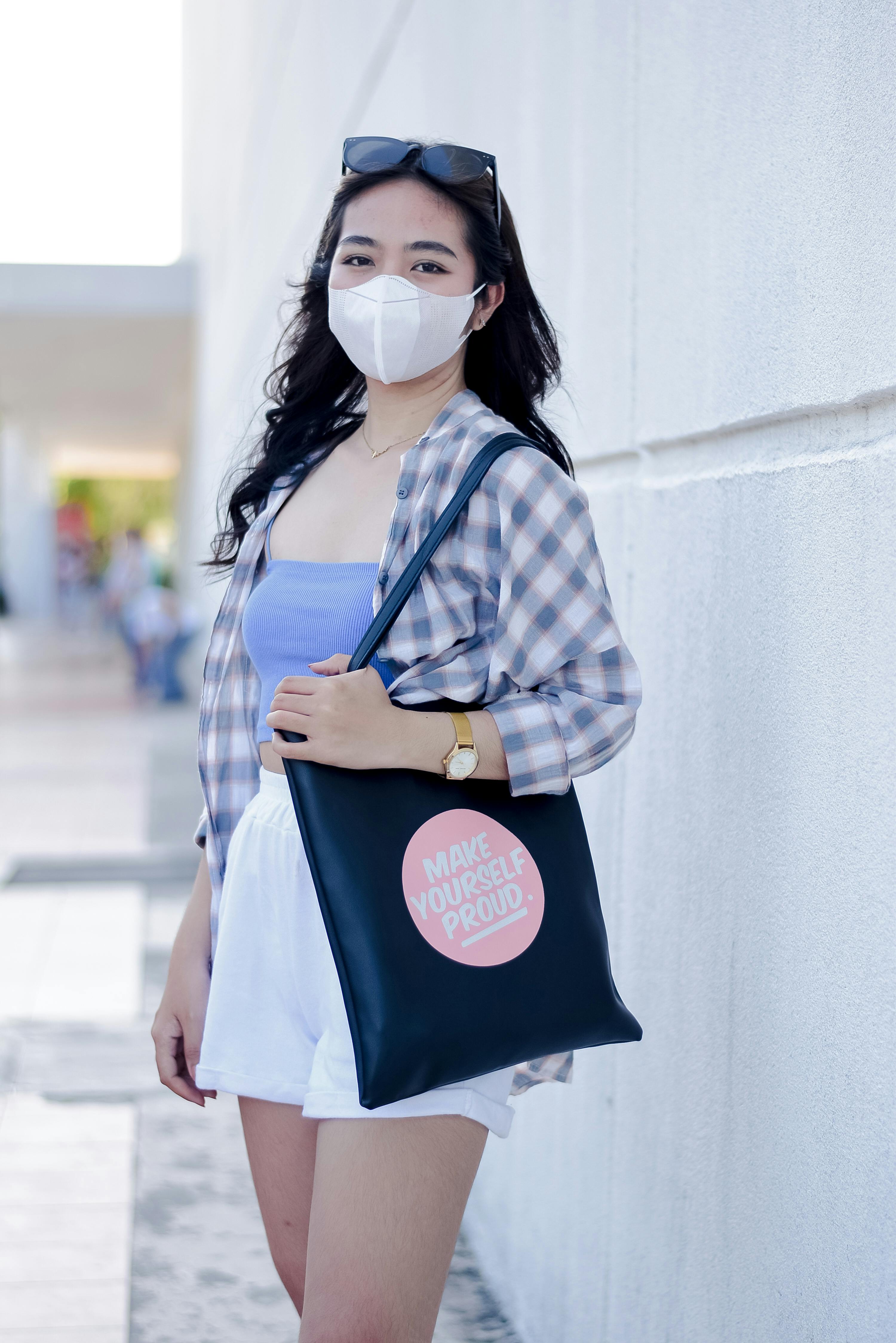 Girl in Face Mask Posing on Street · Free Stock Photo