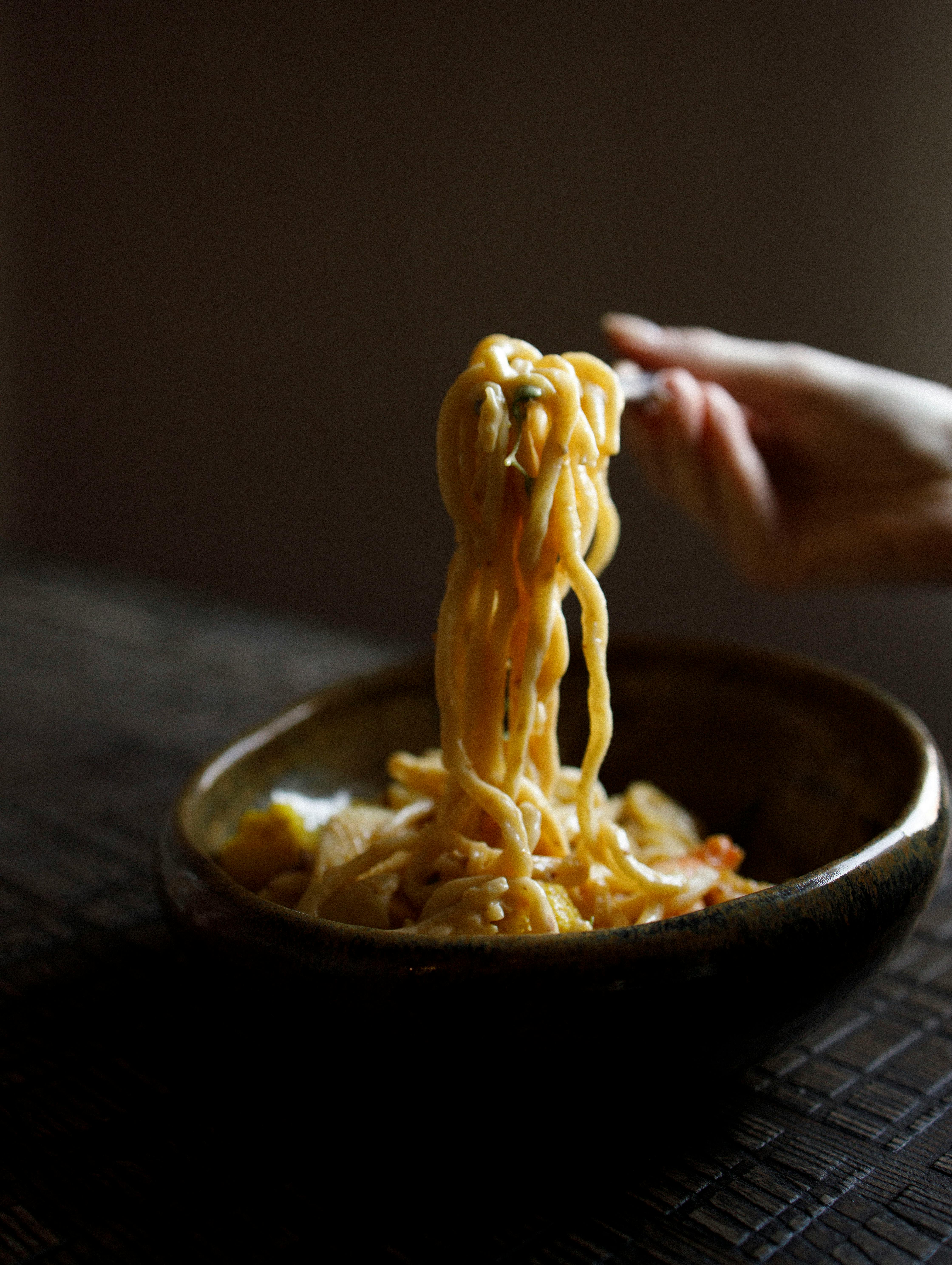 Person Eating Asian Noodles · Free Stock Photo