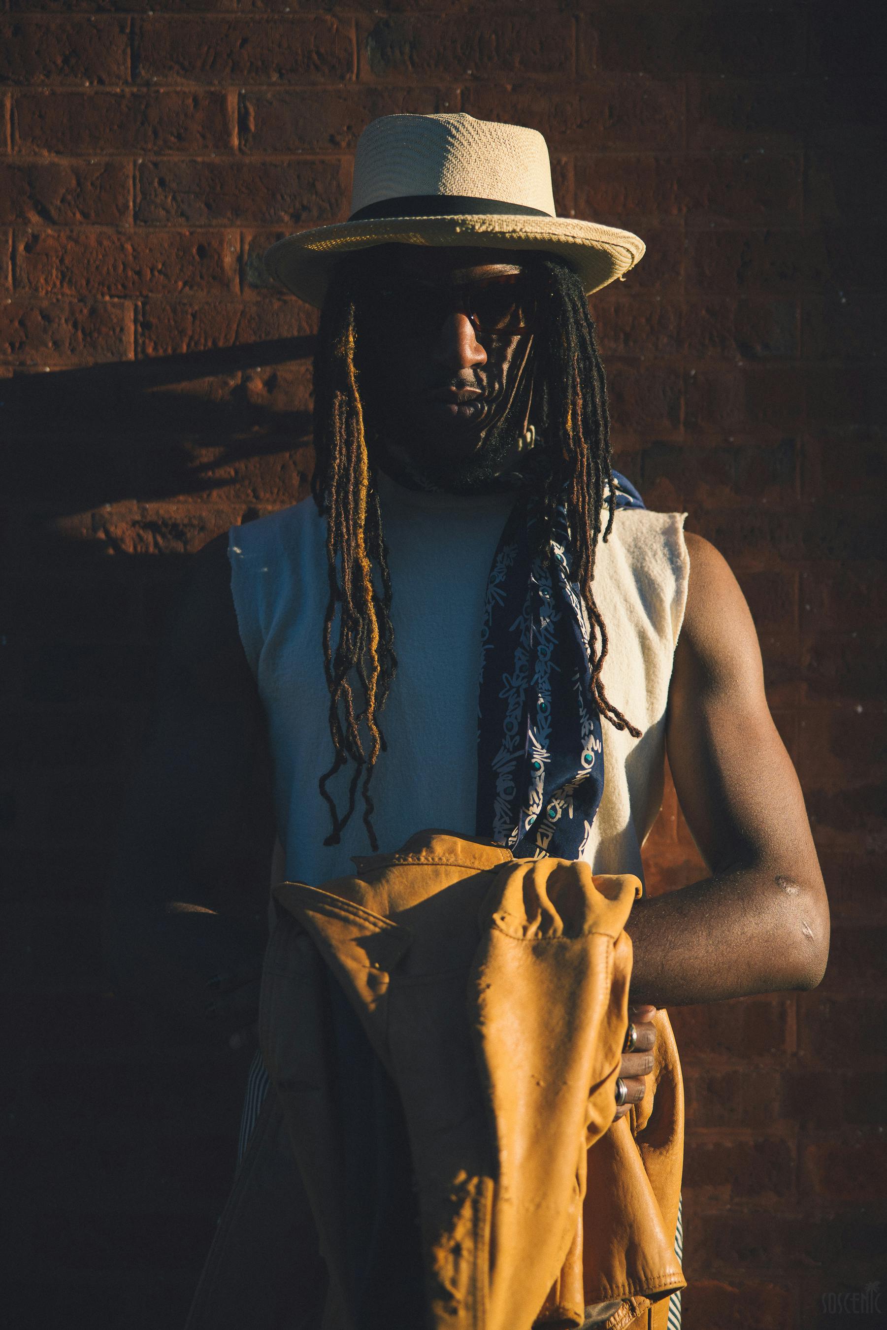 People Wearing Hard Hats Standing Near White Wall while Looking at the ...