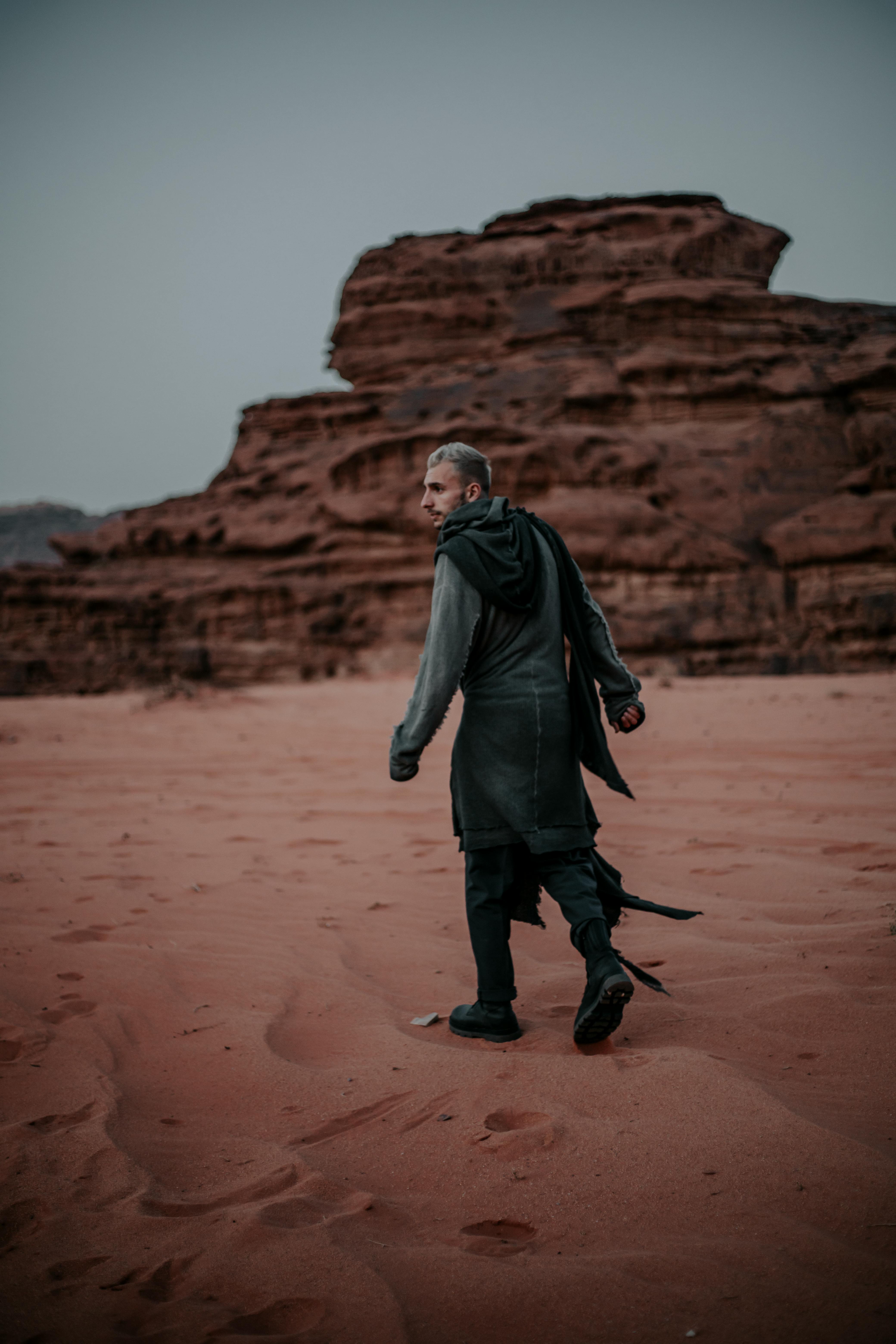 Man Walking in the Sand Storm · Free Stock Photo