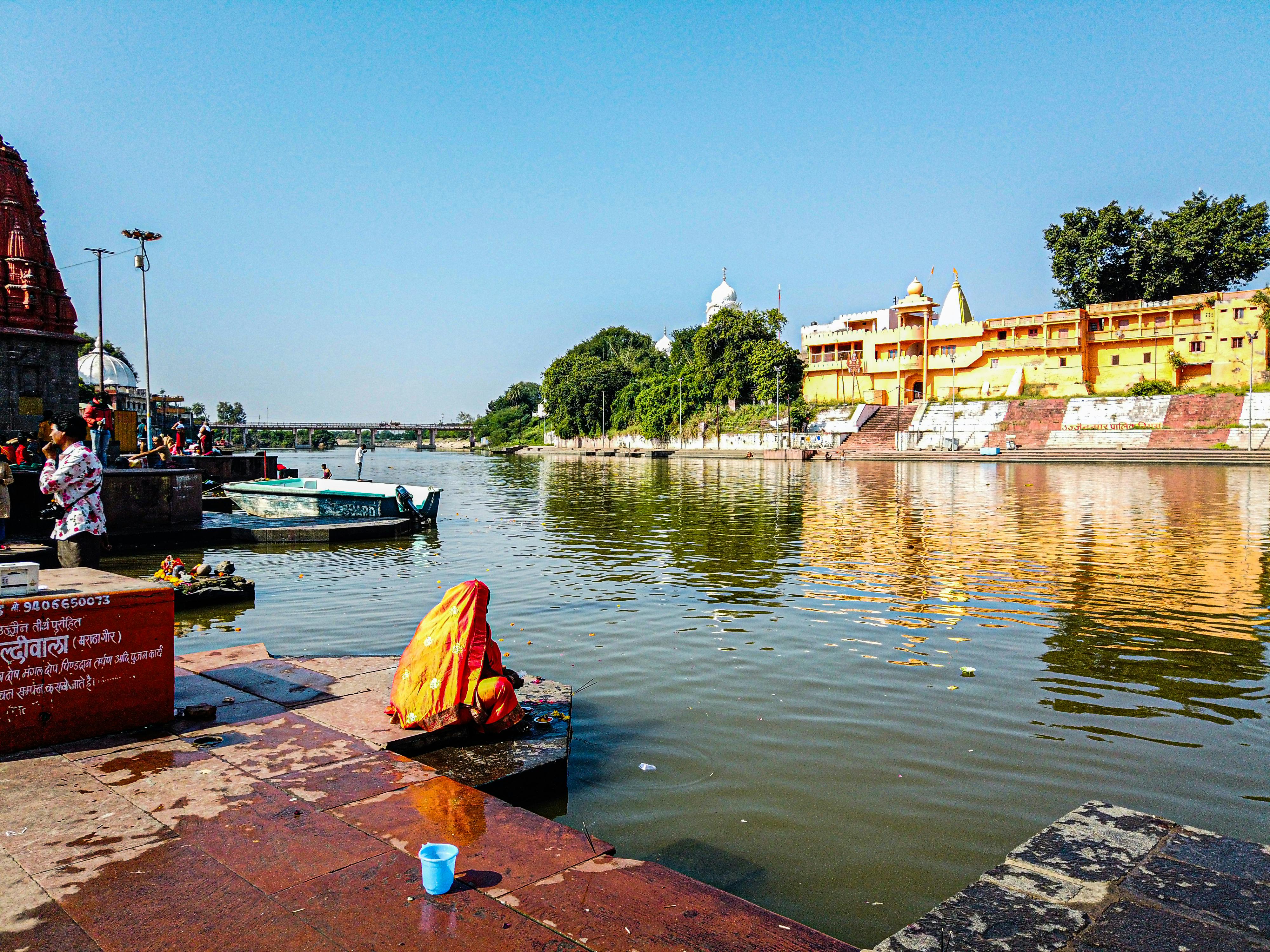 A Person Sitting on Dock · Free Stock Photo
