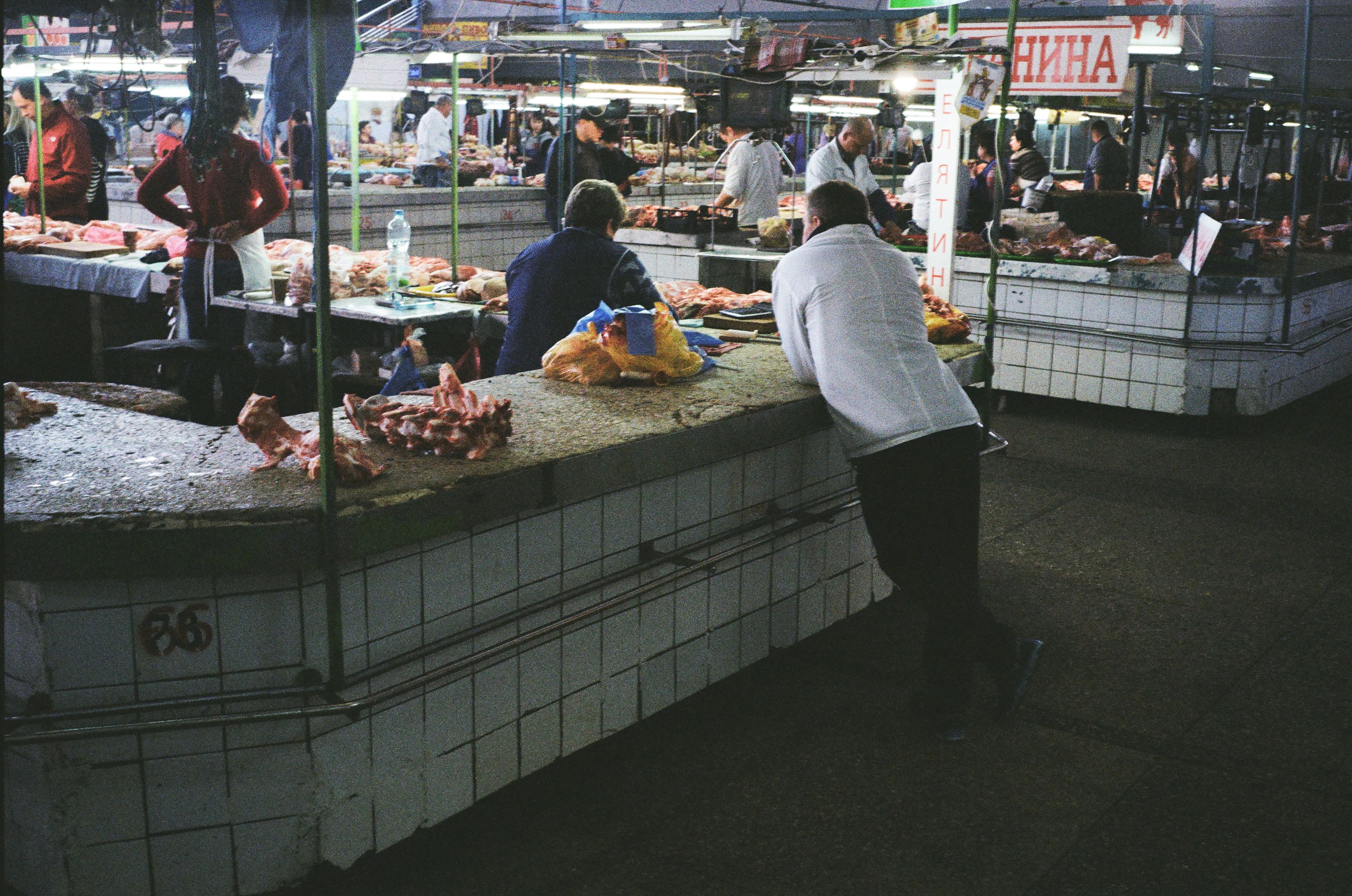 Man Sticking Meat On Stick · Free Stock Photo