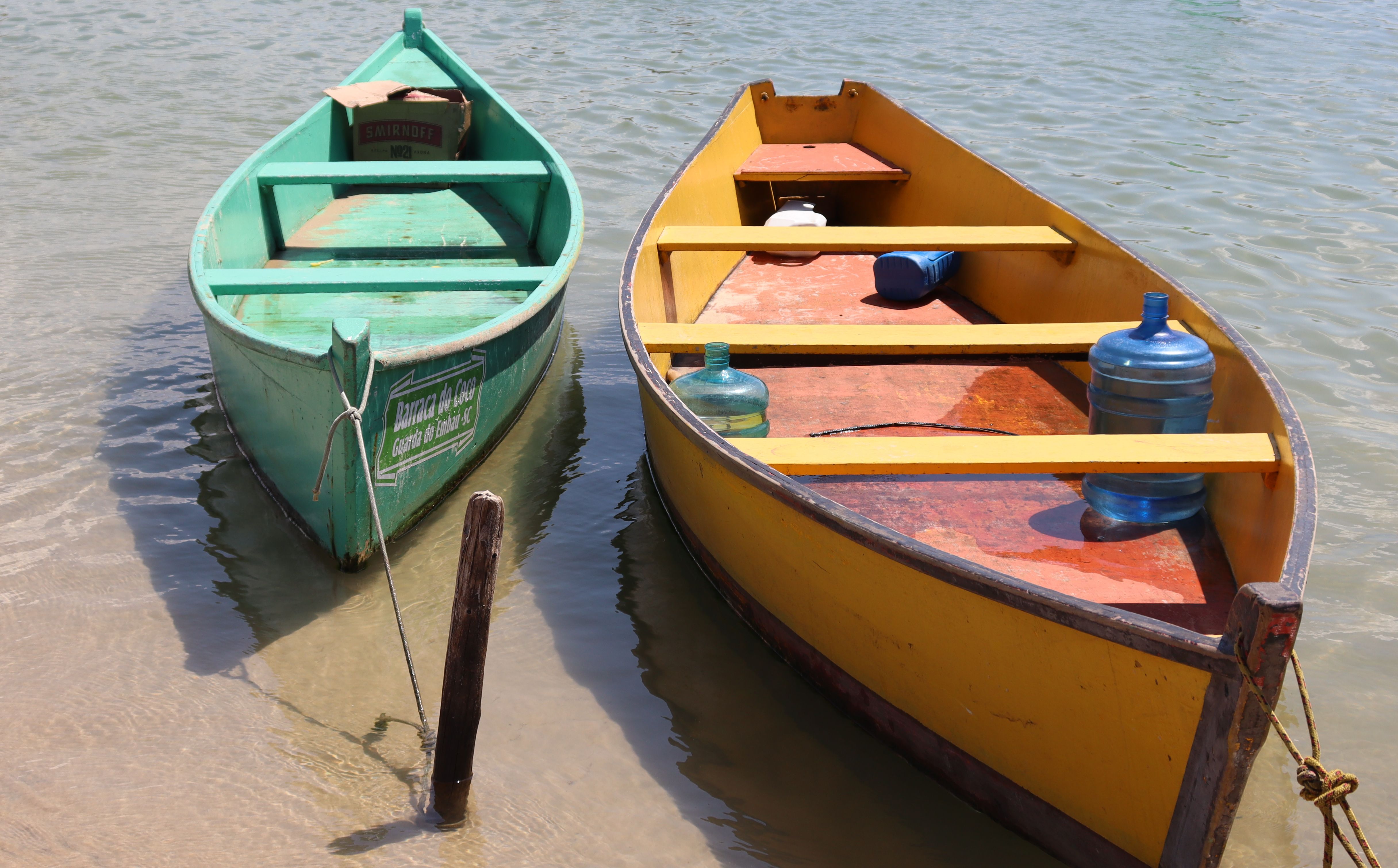Close-Up Shot of Two Boats on Sea Shore · Free Stock Photo
