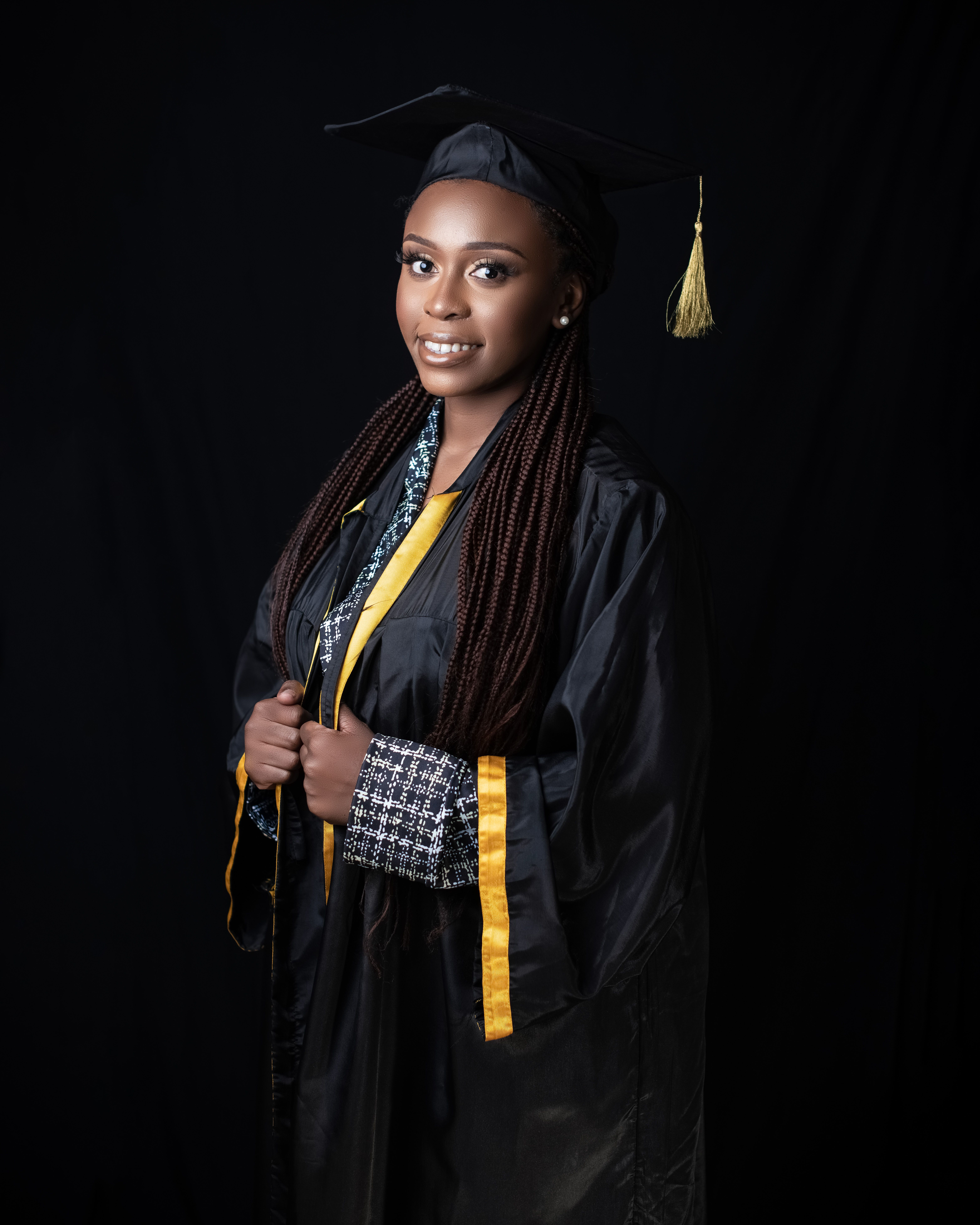 Woman Wearing Graduation Gown · Free Stock Photo