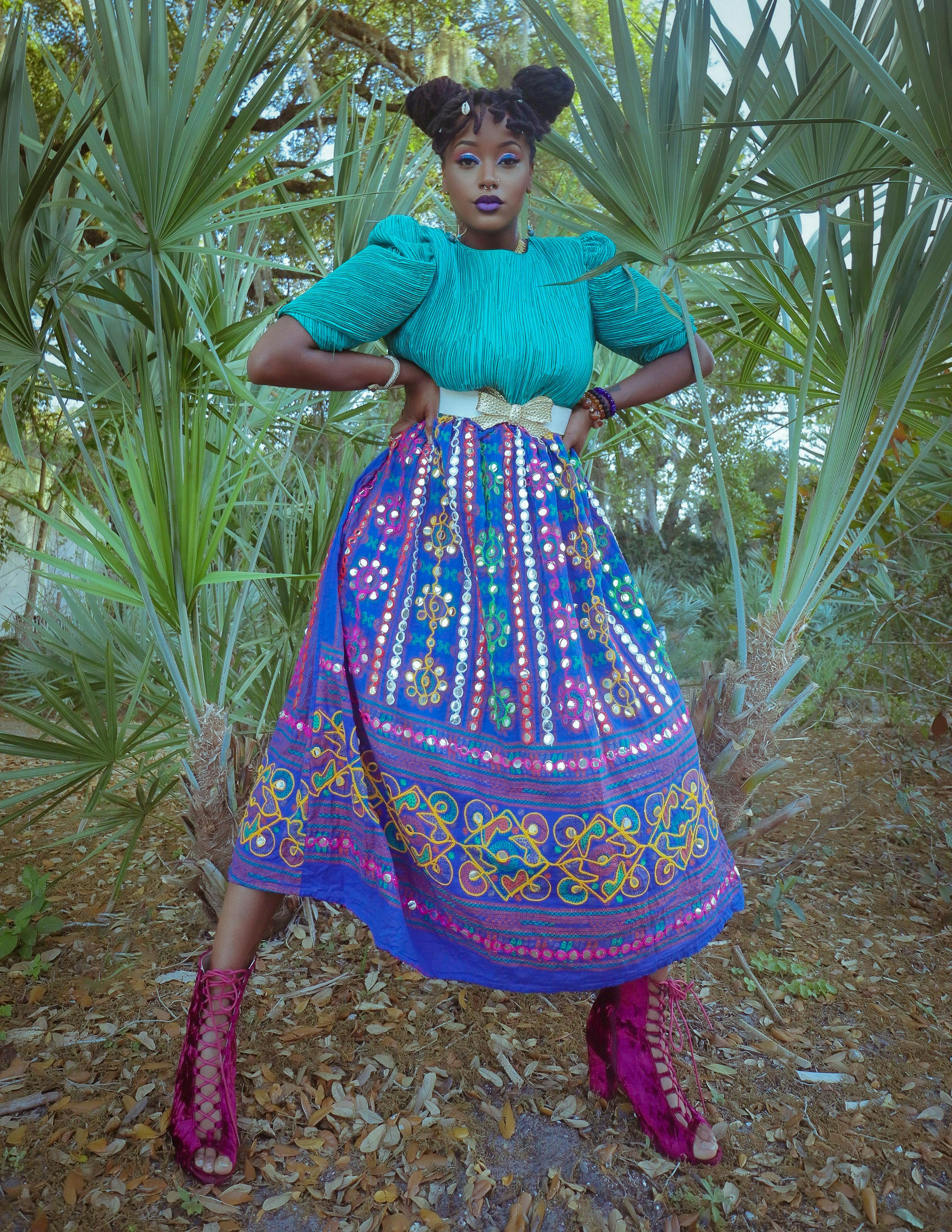 Woman in Patterned Dress · Free Stock Photo