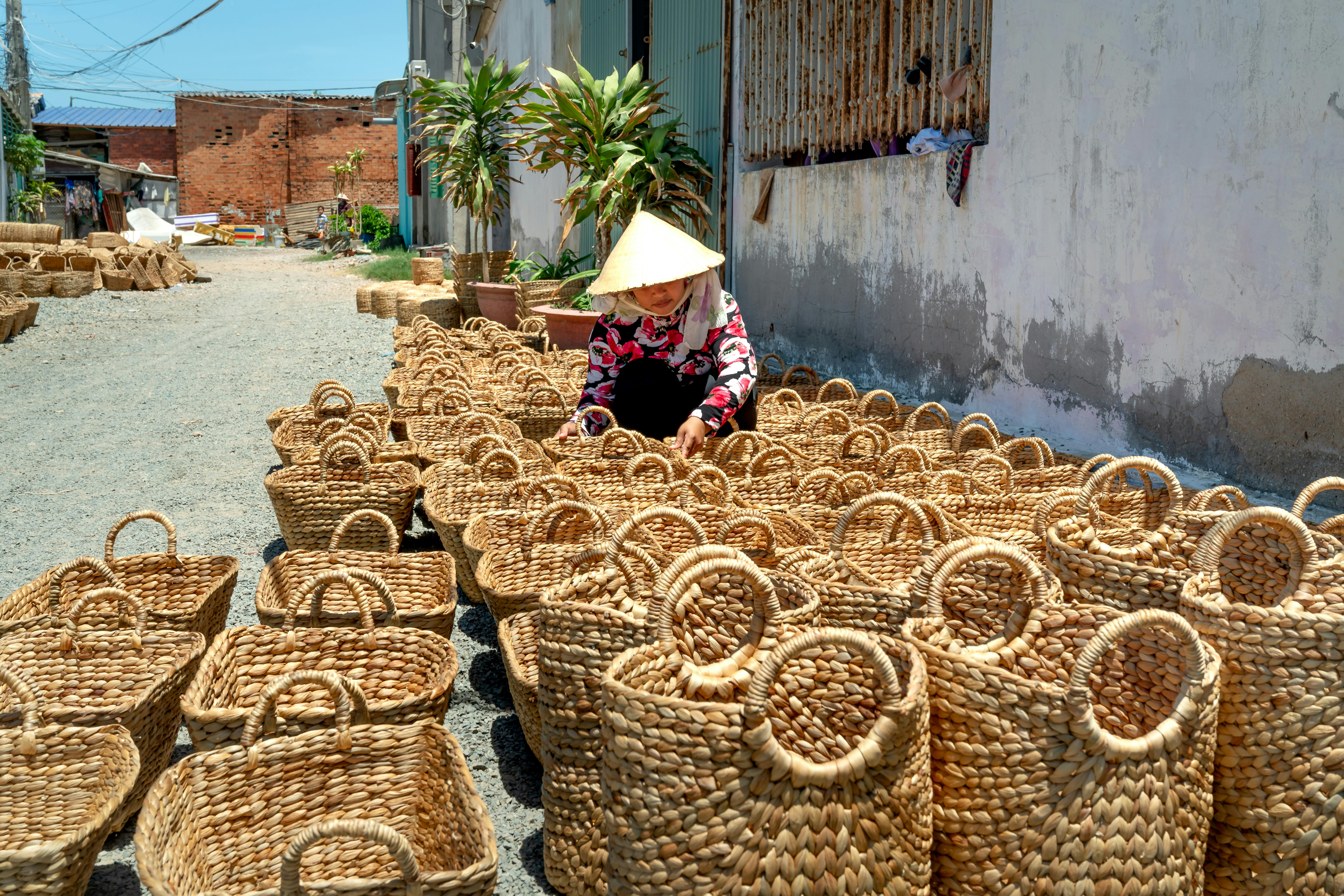 Woman Making Straw Baskets on Street · Free Stock Photo