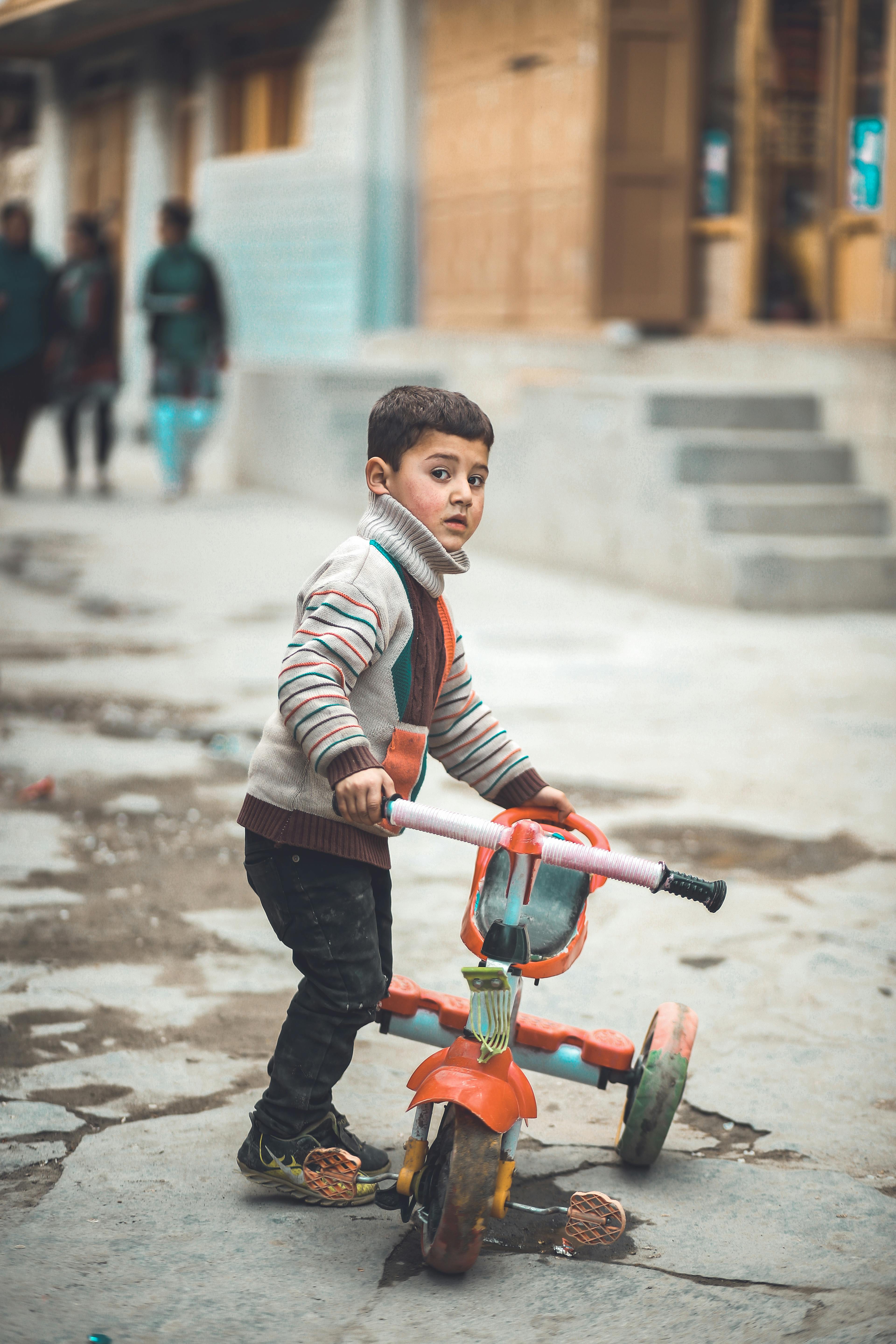 Boy Riding Bike at Daytime · Free Stock Photo