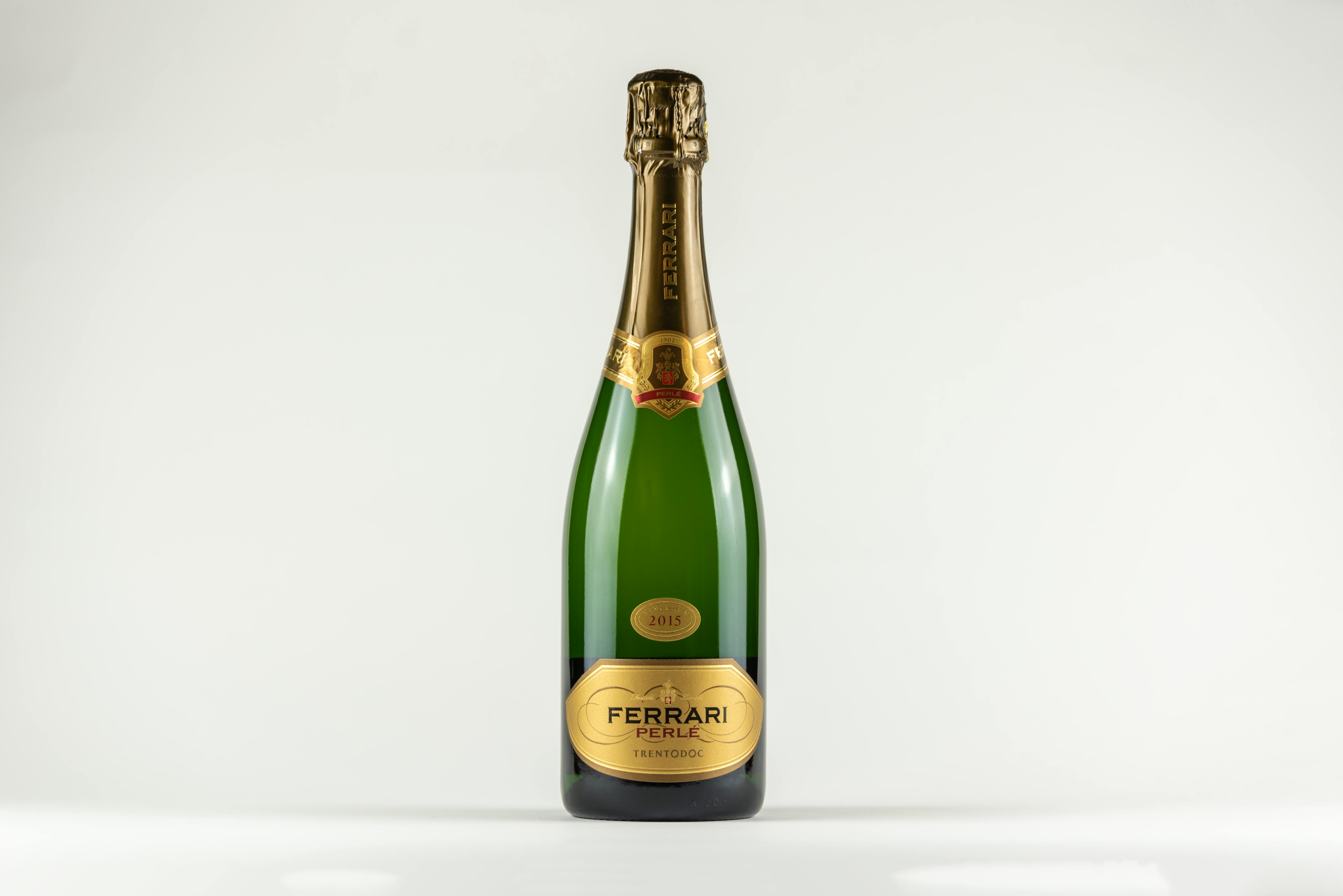 Green Champagne Bottle on White Surface · Free Stock Photo
