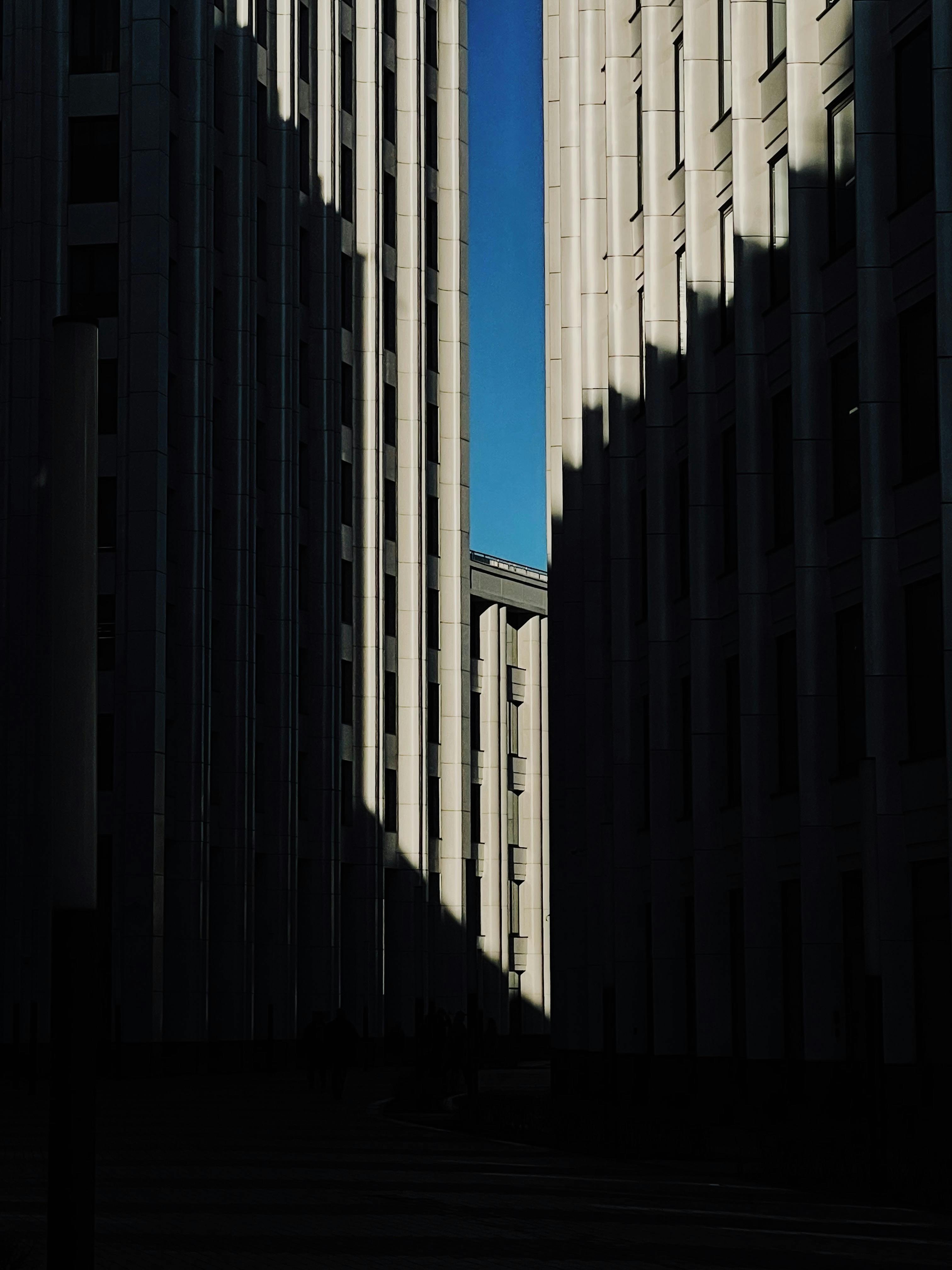 Sky Peeking Through Opening Between Buildings · Free Stock Photo