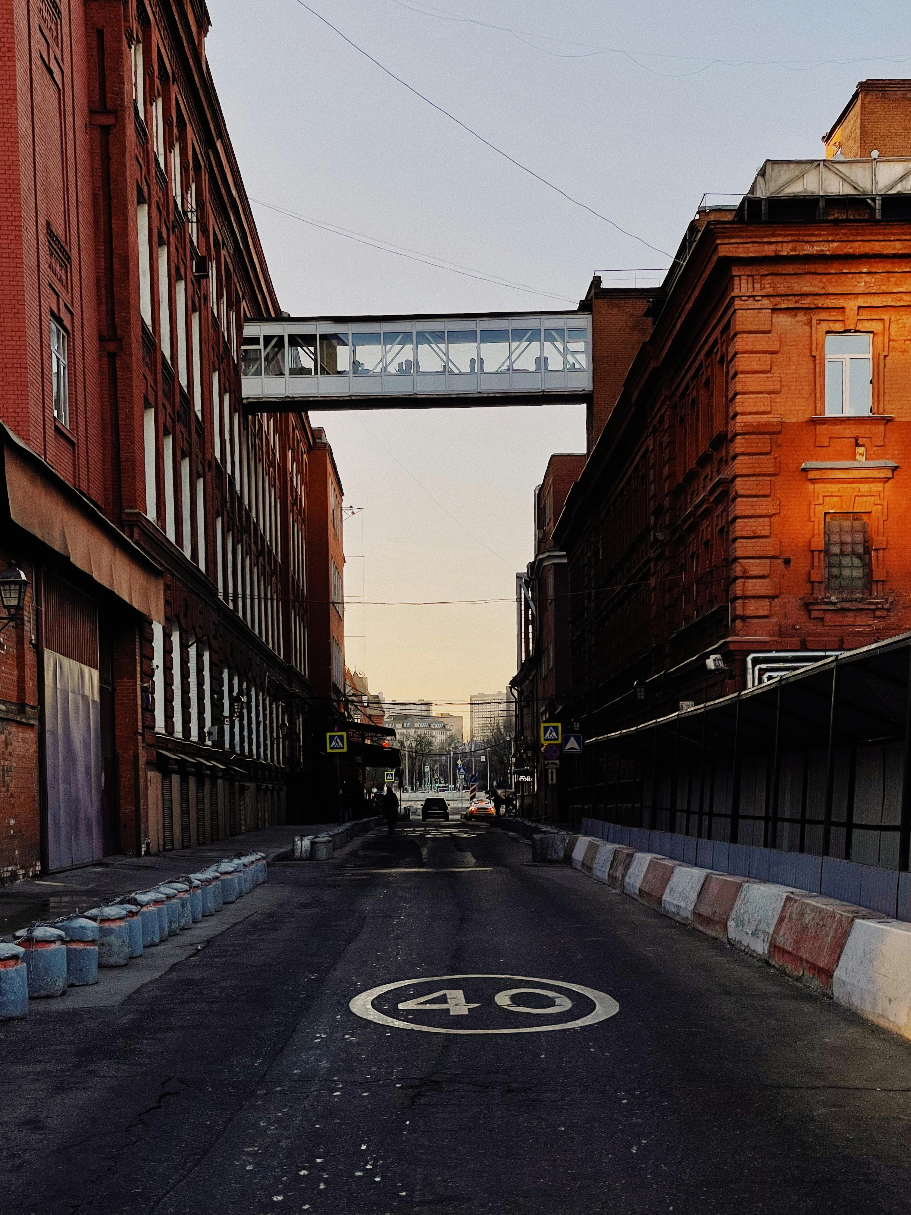 Empty Street Between Concrete Buildings · Free Stock Photo