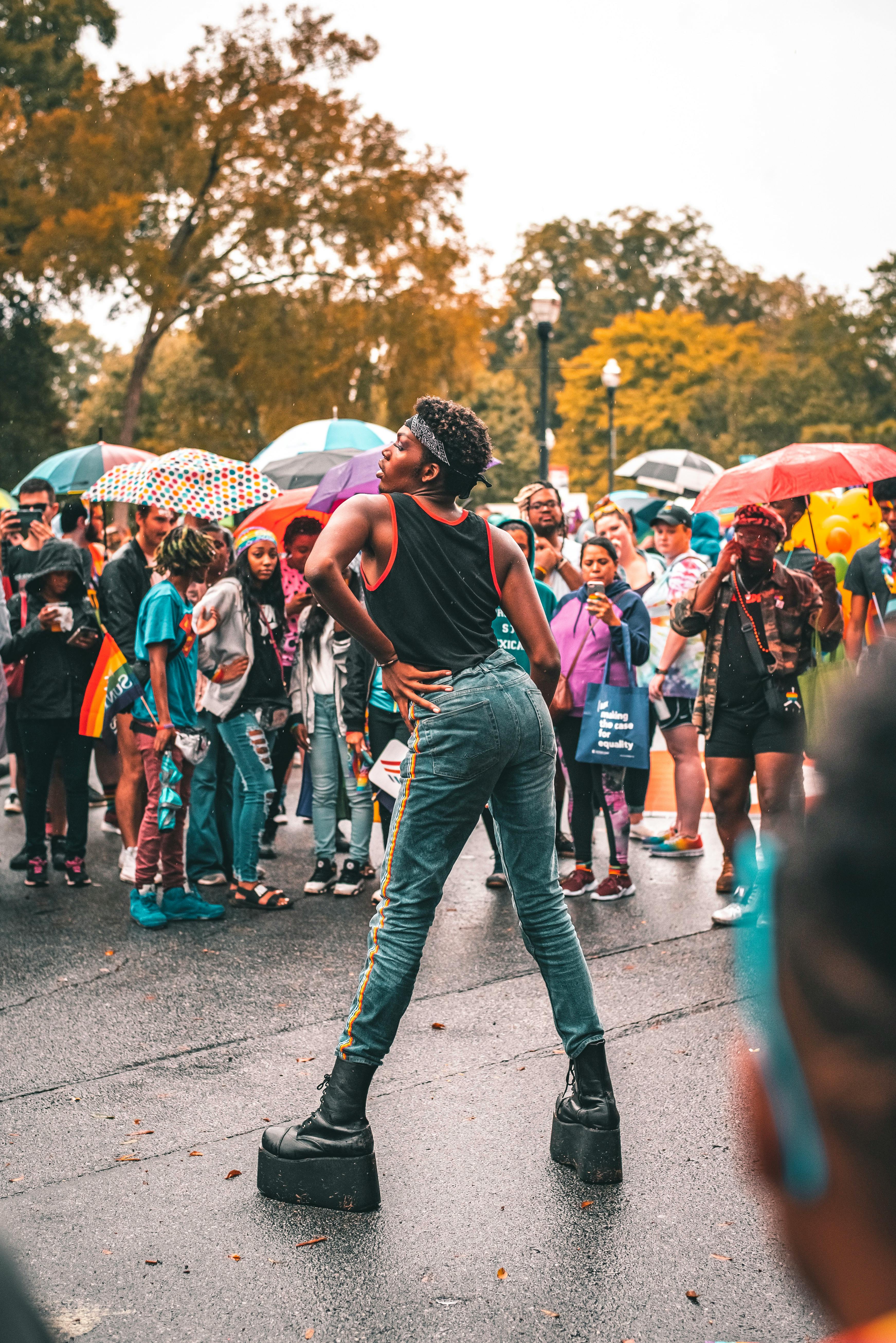 Person in Retro Outfit Dancing on Street in Front of a Crowd · Free ...